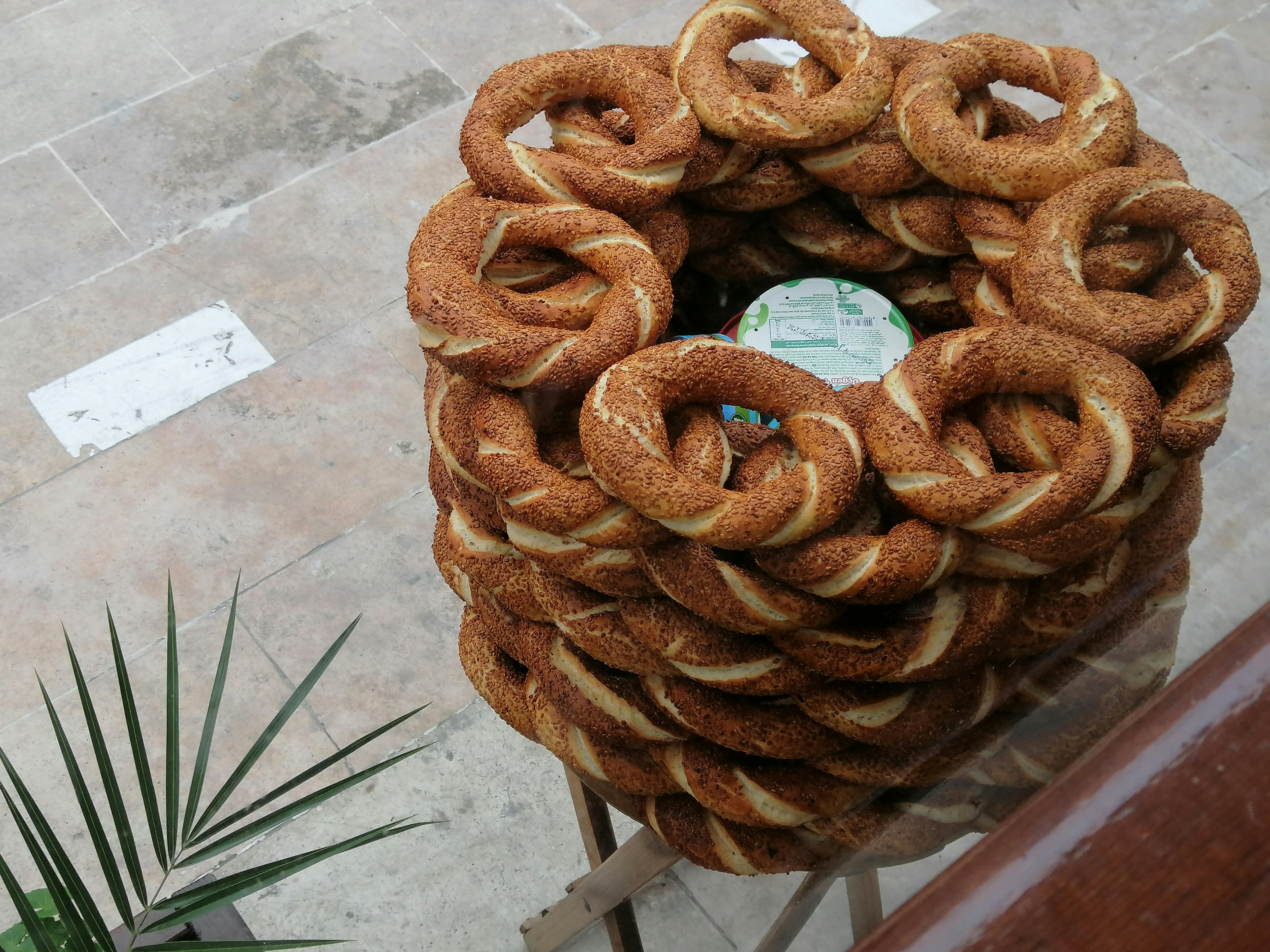 Stack of Freshly Baked Turkish Simit Bread Outdoors · Free Stock Photo