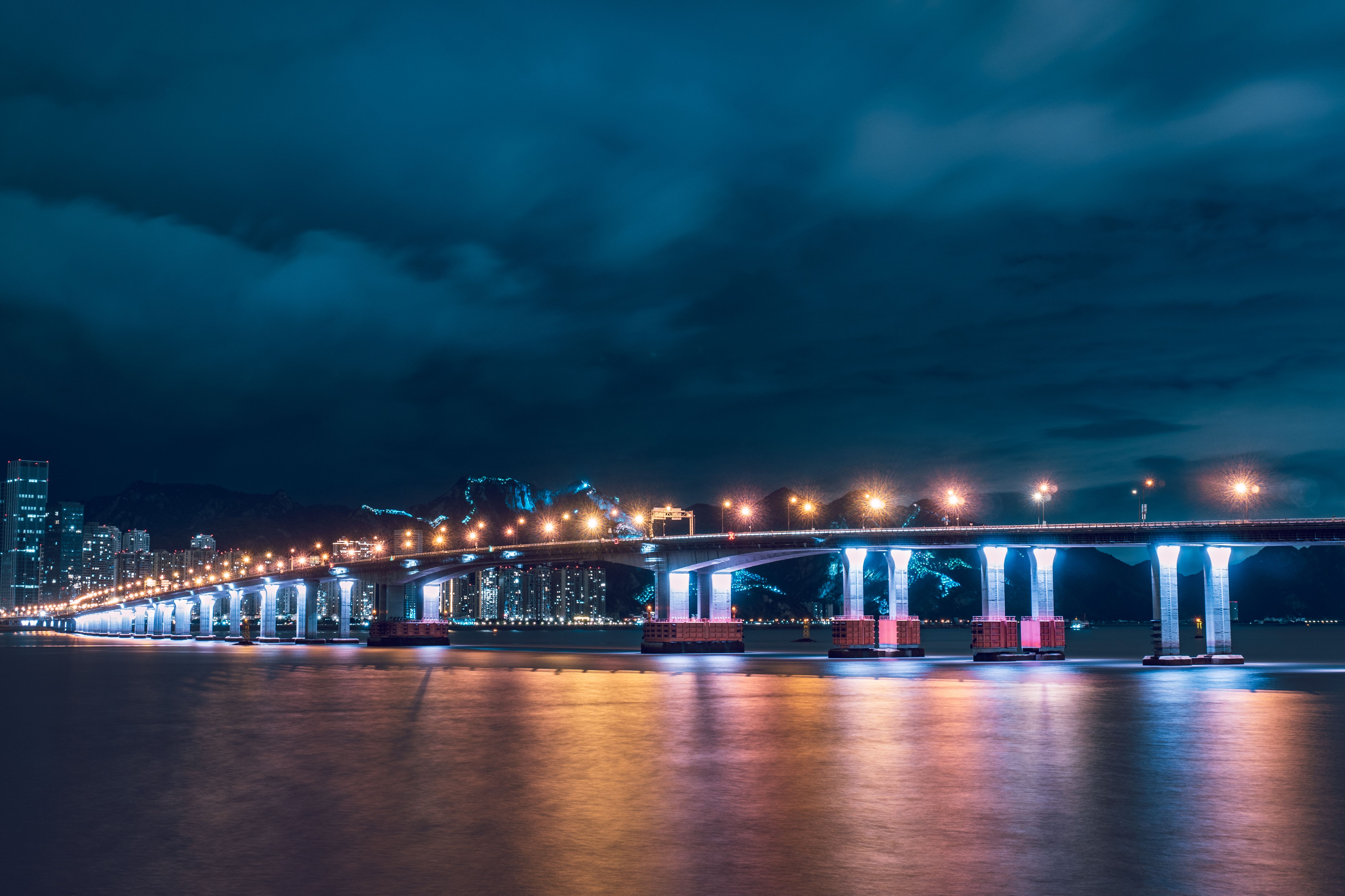 Night Bridge with Cityscape and Reflections · Free Stock Photo