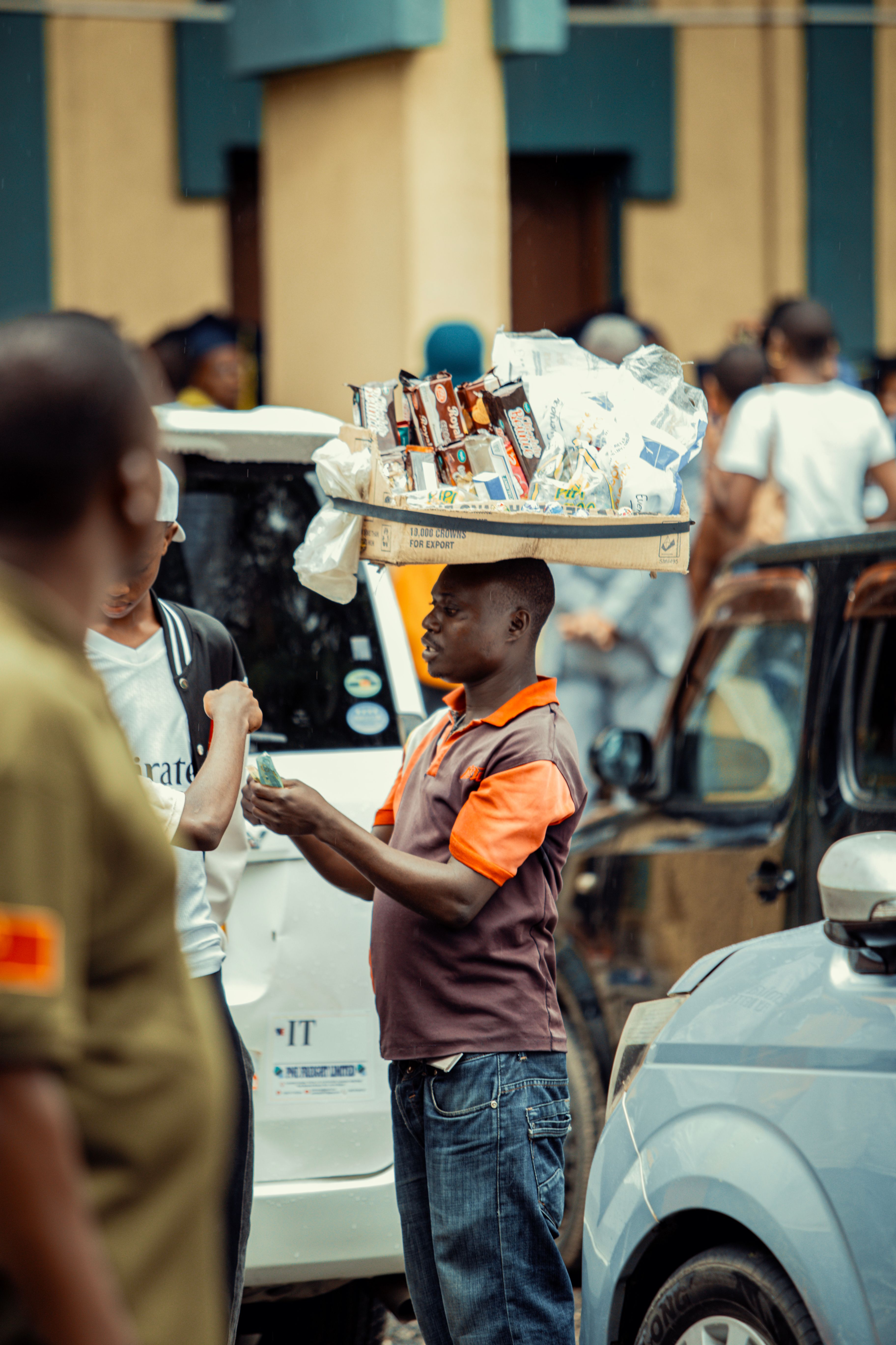 Street Vendor Selling Snacks in Busy African City · Free Stock Photo
