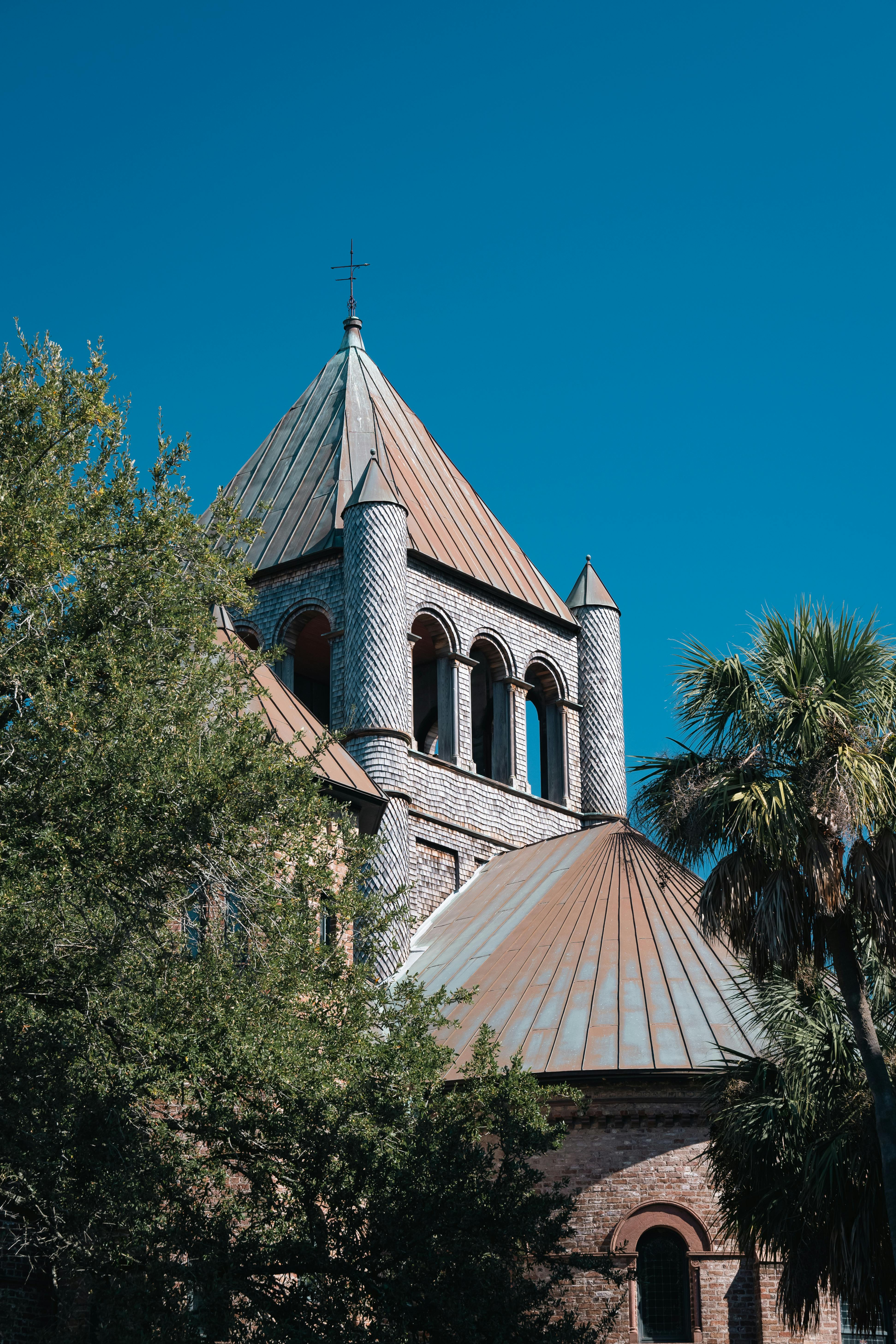 Historic Church Architecture with Vegetation · Free Stock Photo