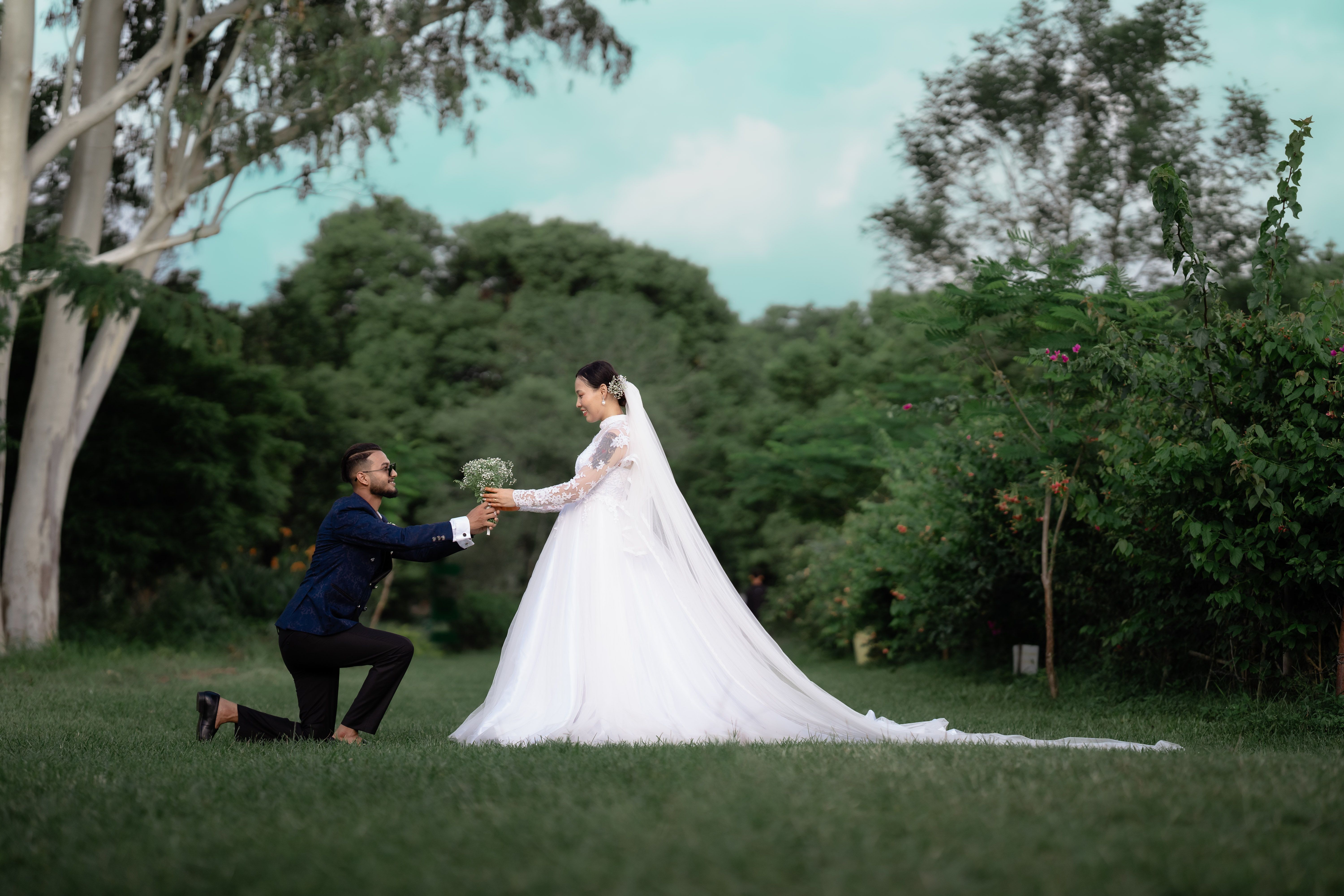 Romantic Wedding Proposal in Lush Greenery · Free Stock Photo