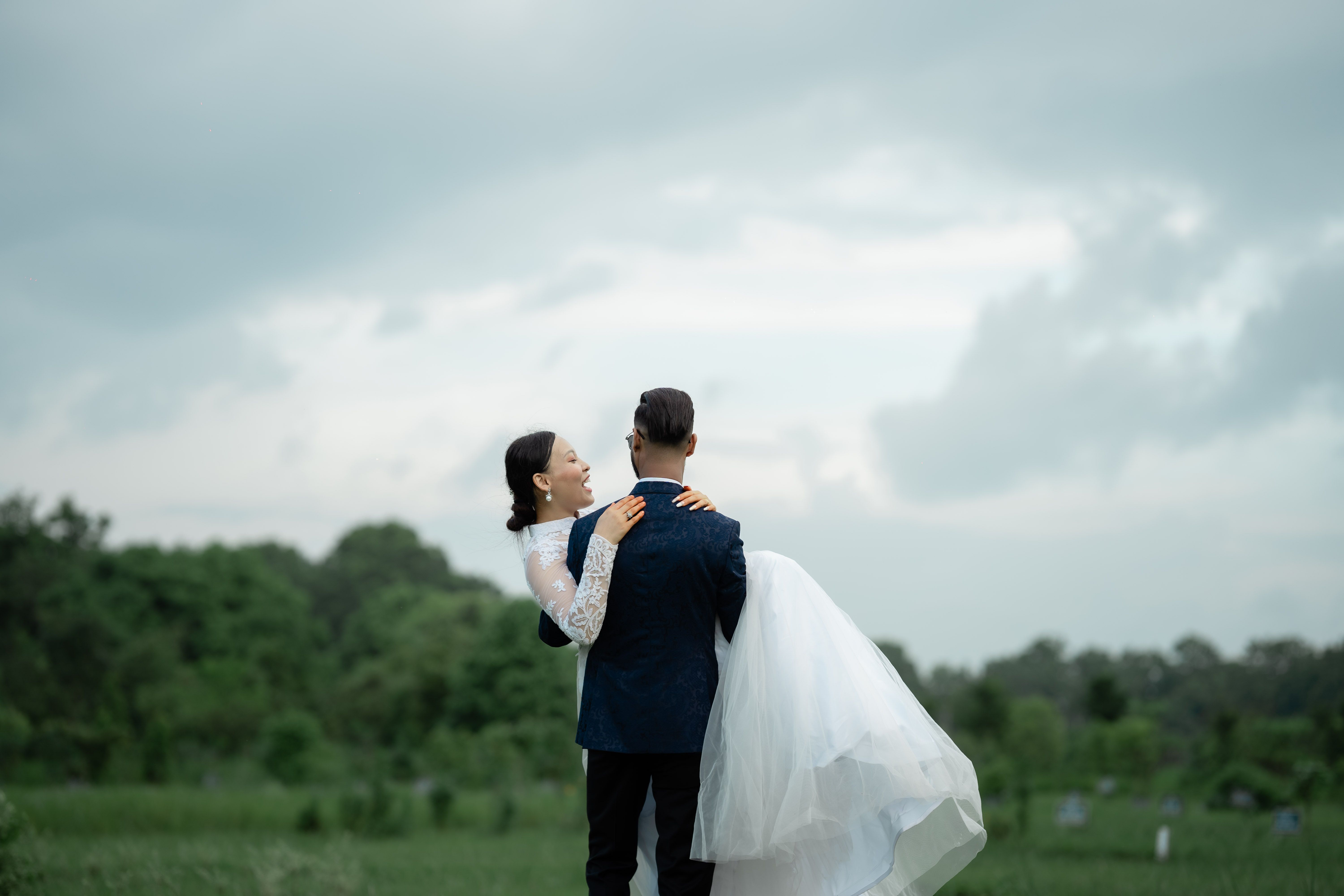 Romantic Wedding Couple in Scenic Outdoor Setting · Free Stock Photo