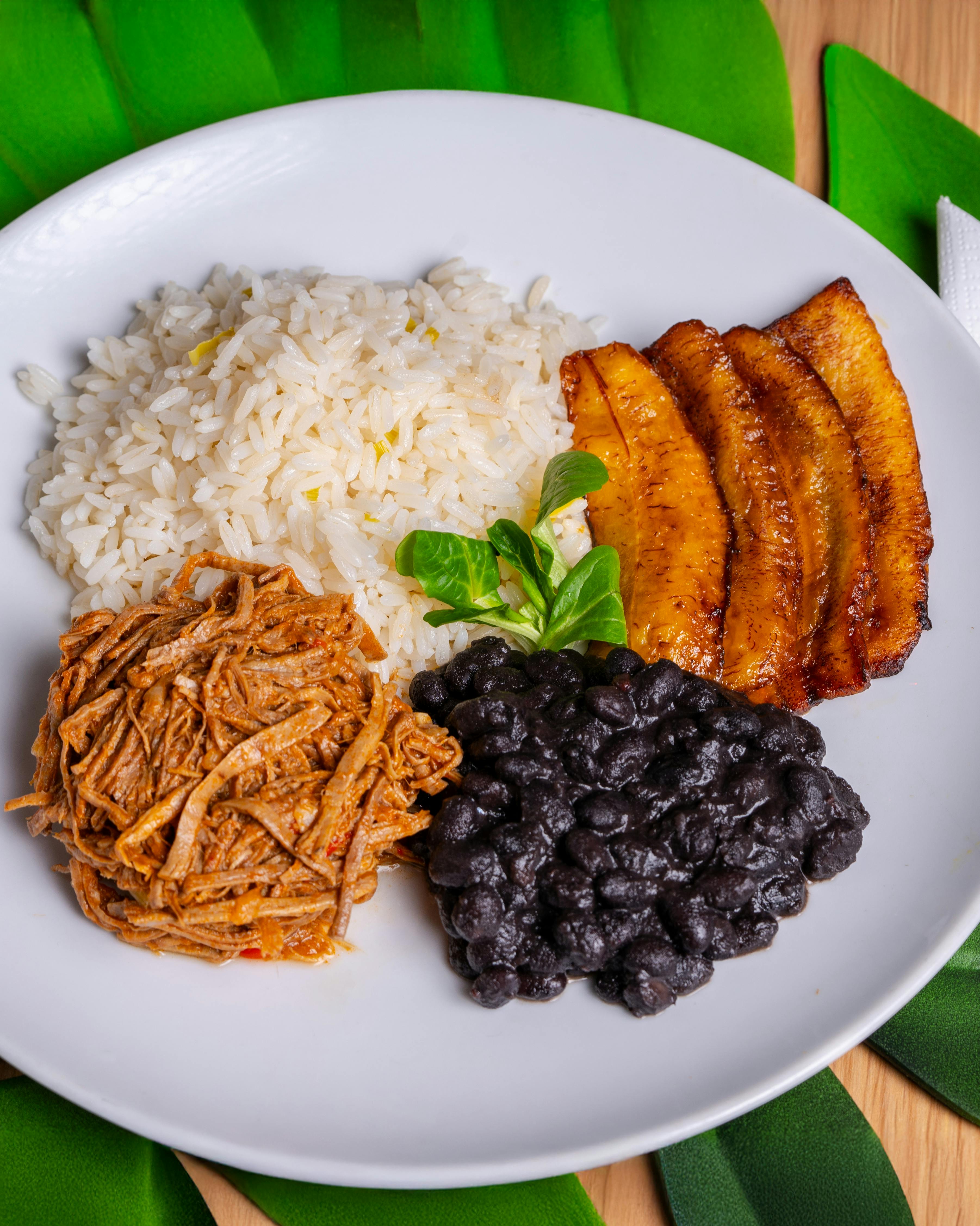 Delicious Latin American Rice and Plantains Dish · Free Stock Photo