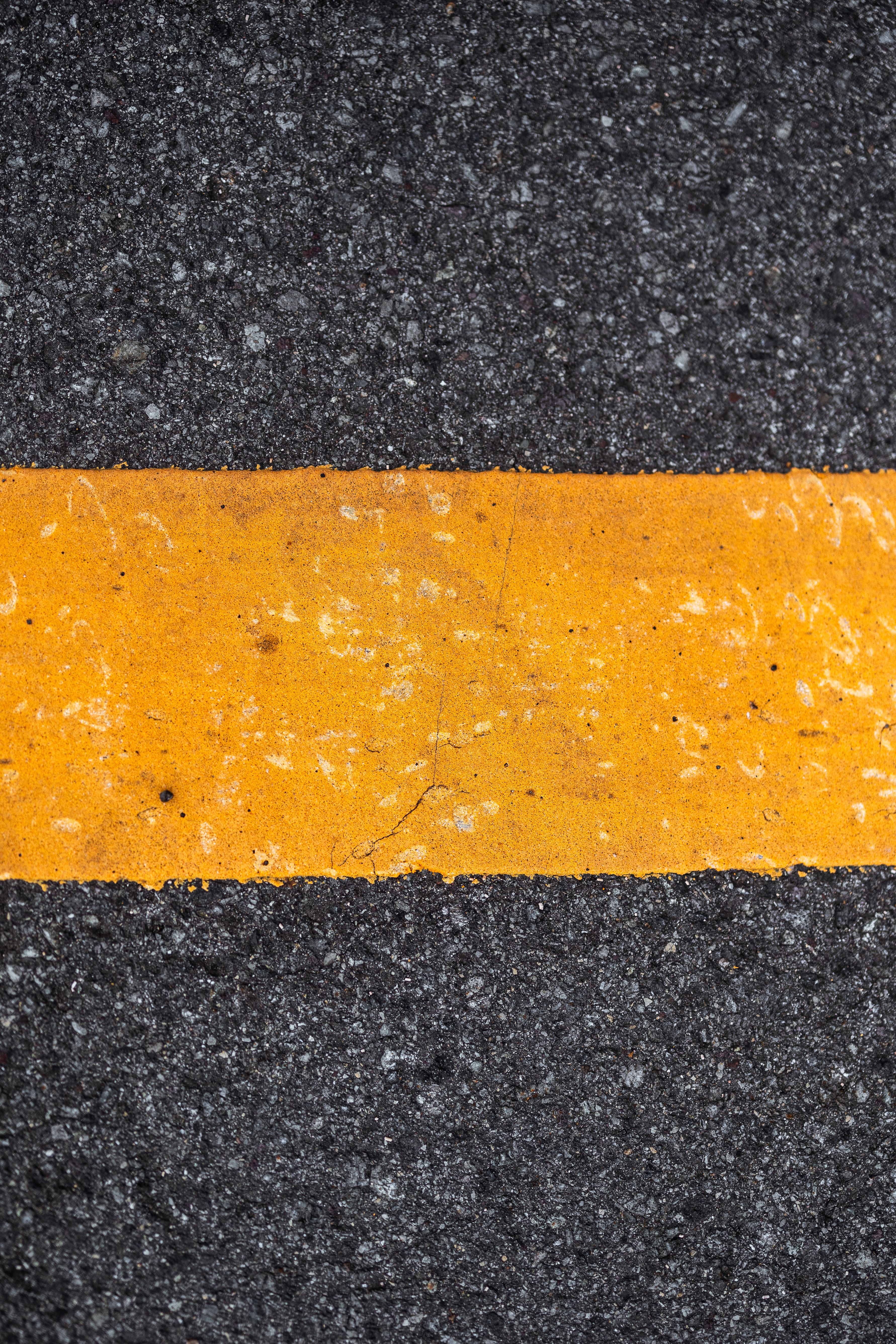 Close-up of Asphalt with Orange Road Line · Free Stock Photo