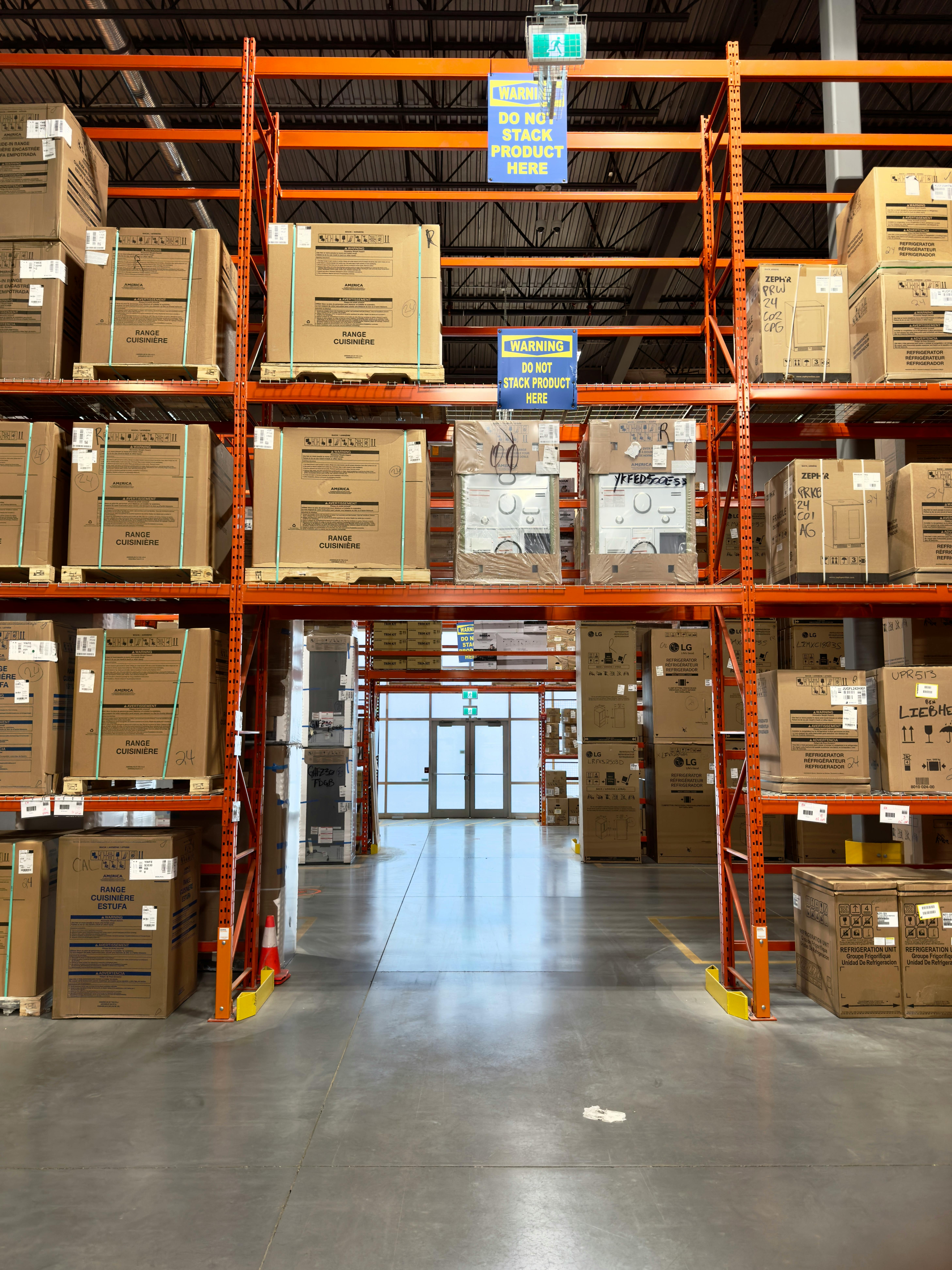 Boxes on Shelves inside a Warehouse · Free Stock Photo