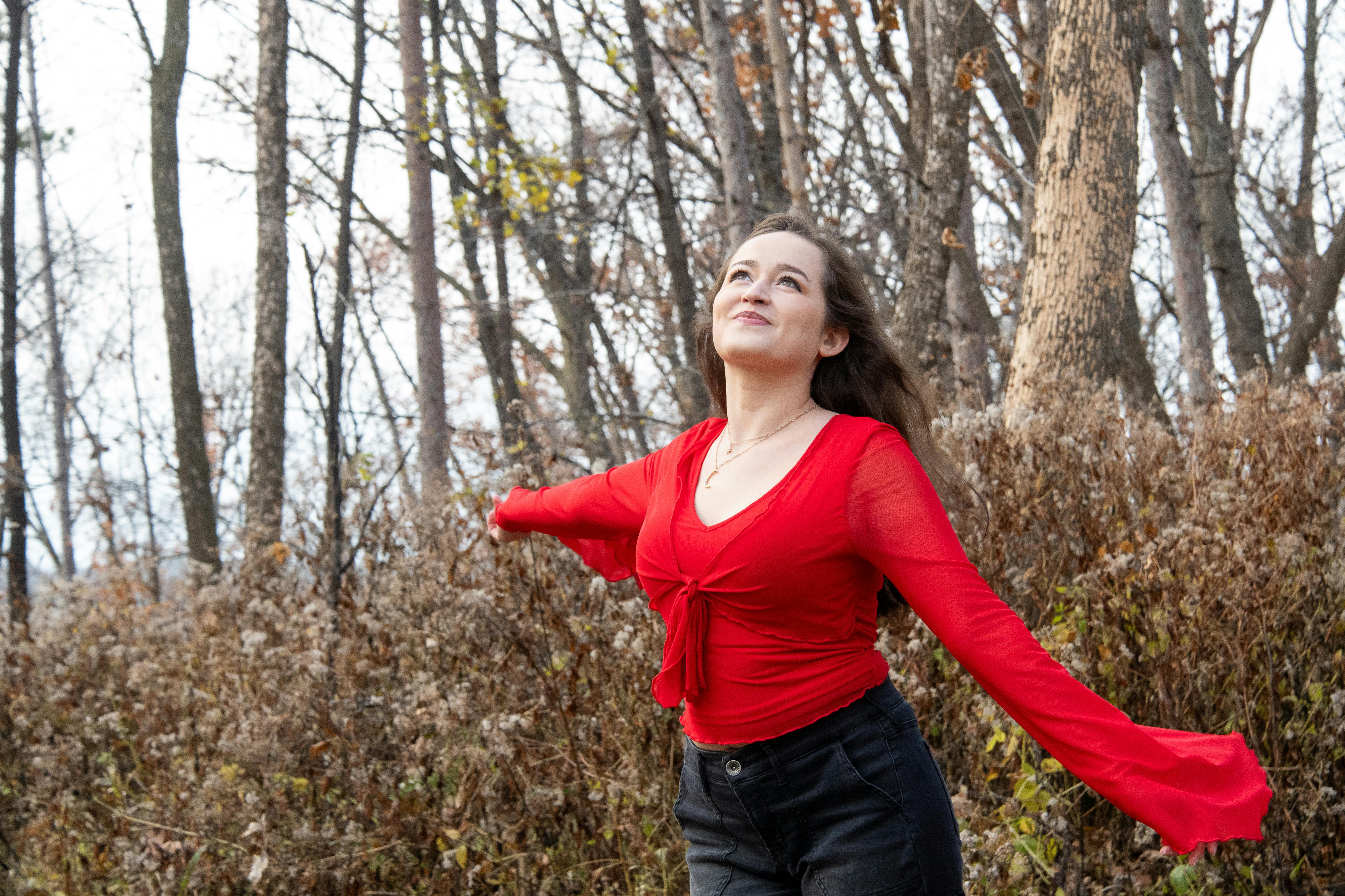 Joyful Woman in Red Blouse in Forest · Free Stock Photo