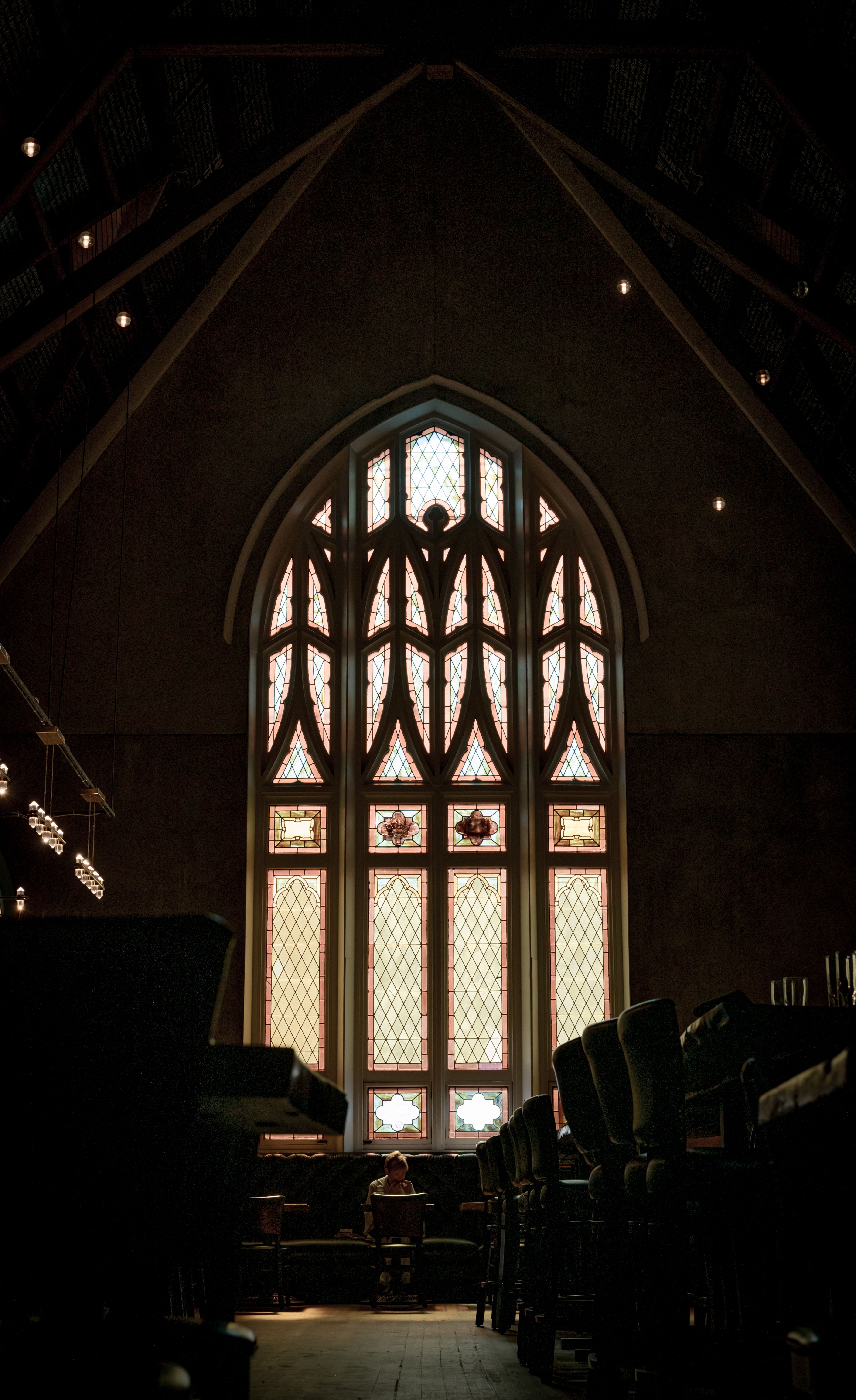 Gothic Style Church Interior with Stained Glass Window · Free Stock Photo