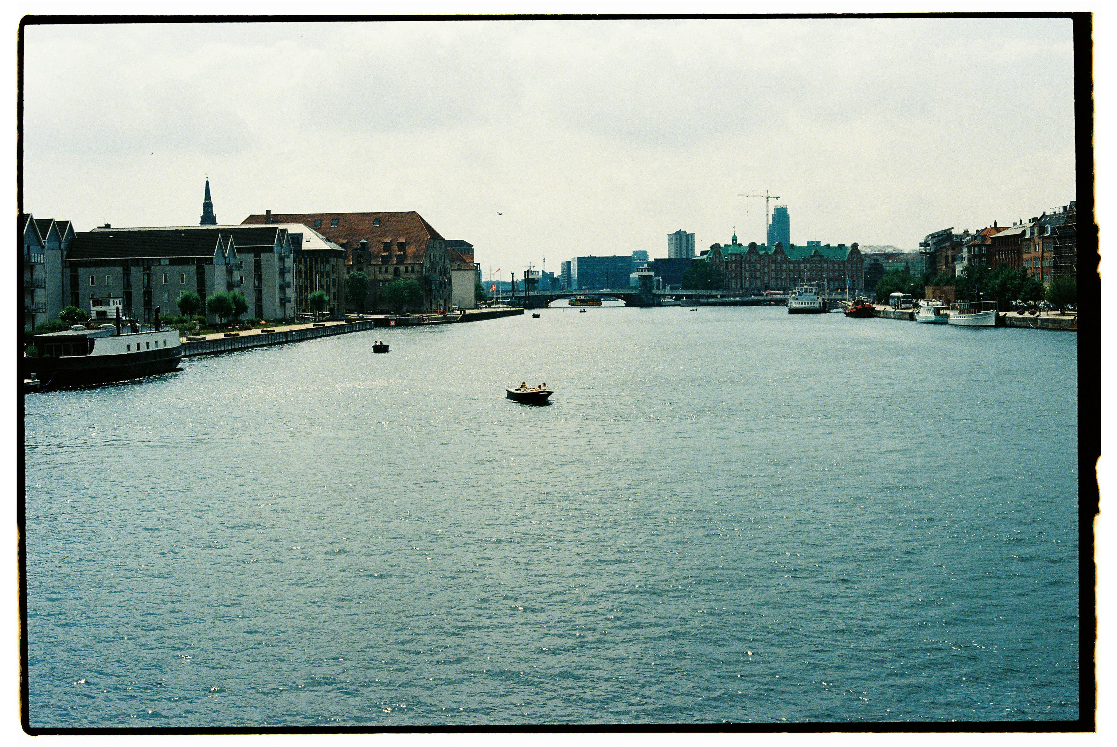Scenic Waterfront View with Boats and Skyline · Free Stock Photo