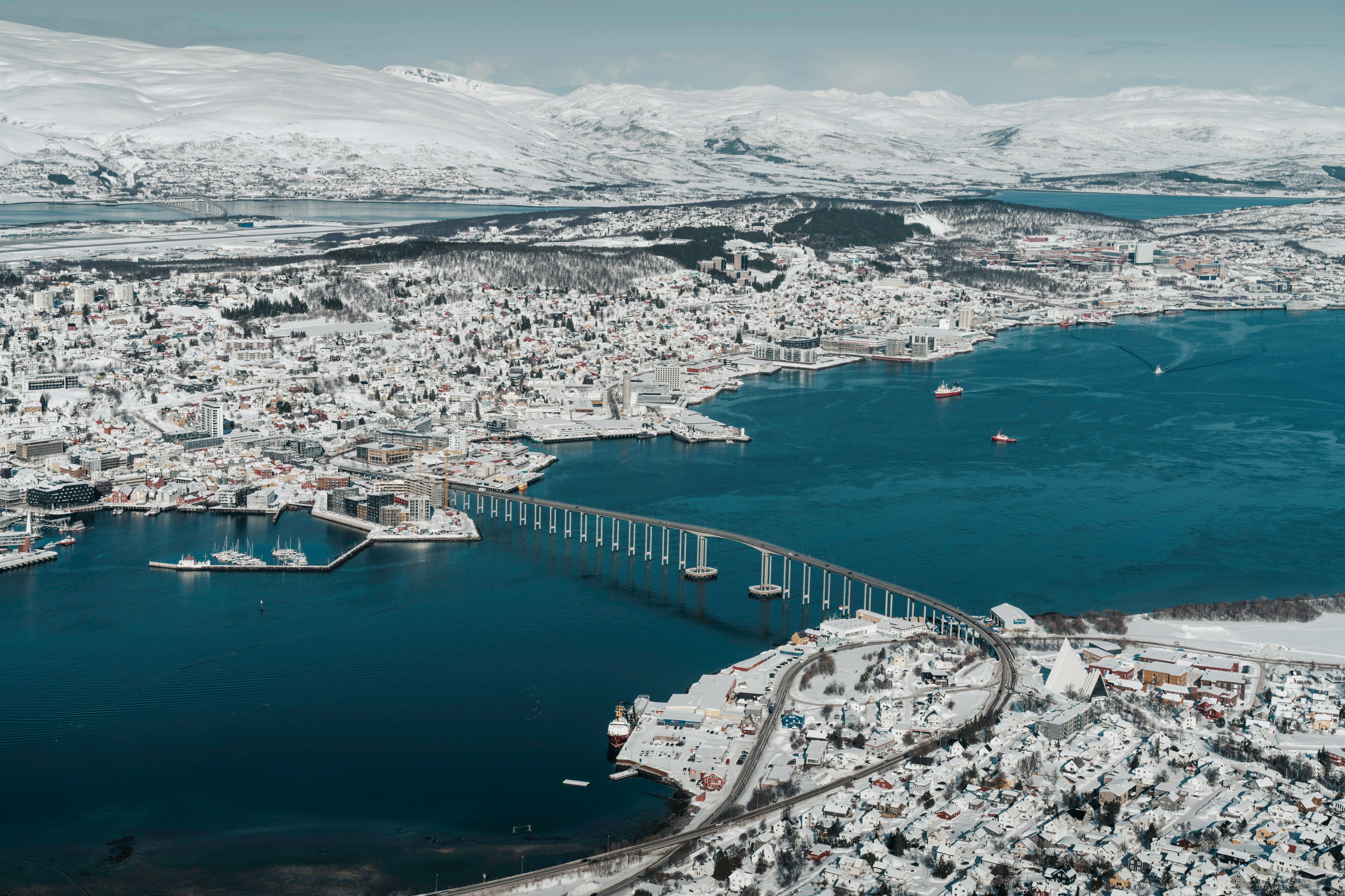Aerial View of Snowy Tromsø with Iconic Bridge · Free Stock Photo