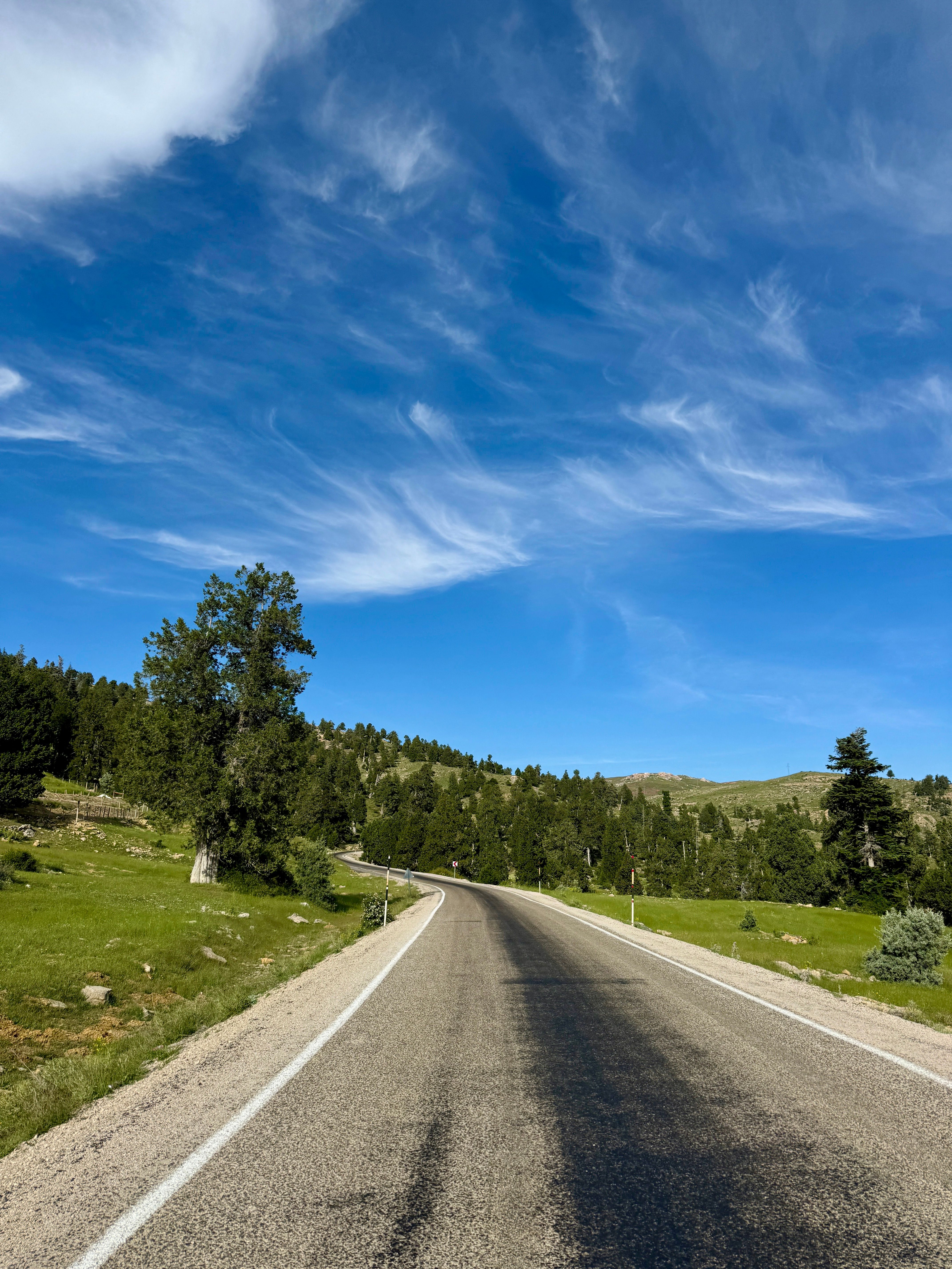 Scenic Country Road Under Clear Blue Sky · Free Stock Photo