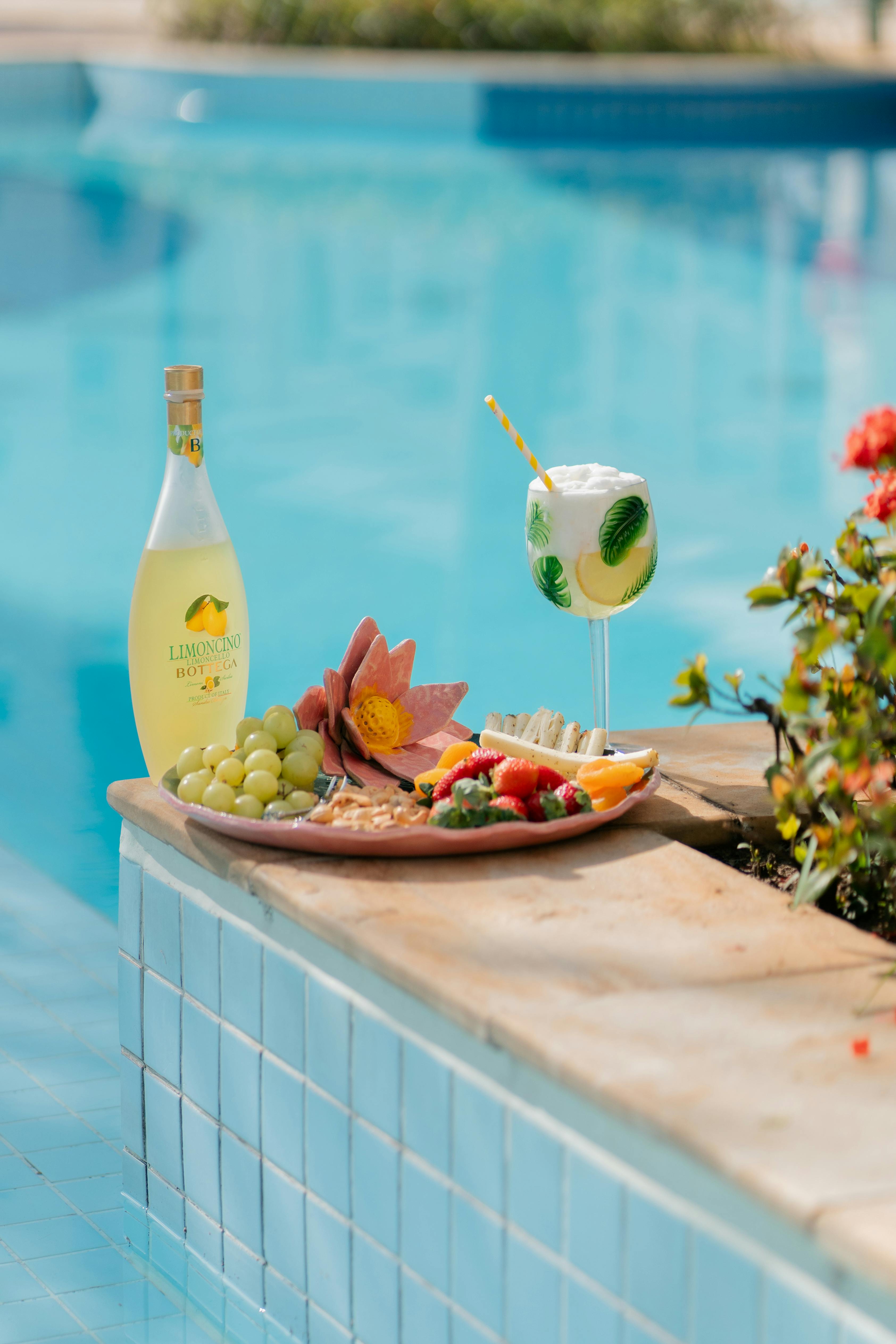 Refreshing Poolside Lemonade and Fruit Platter · Free Stock Photo