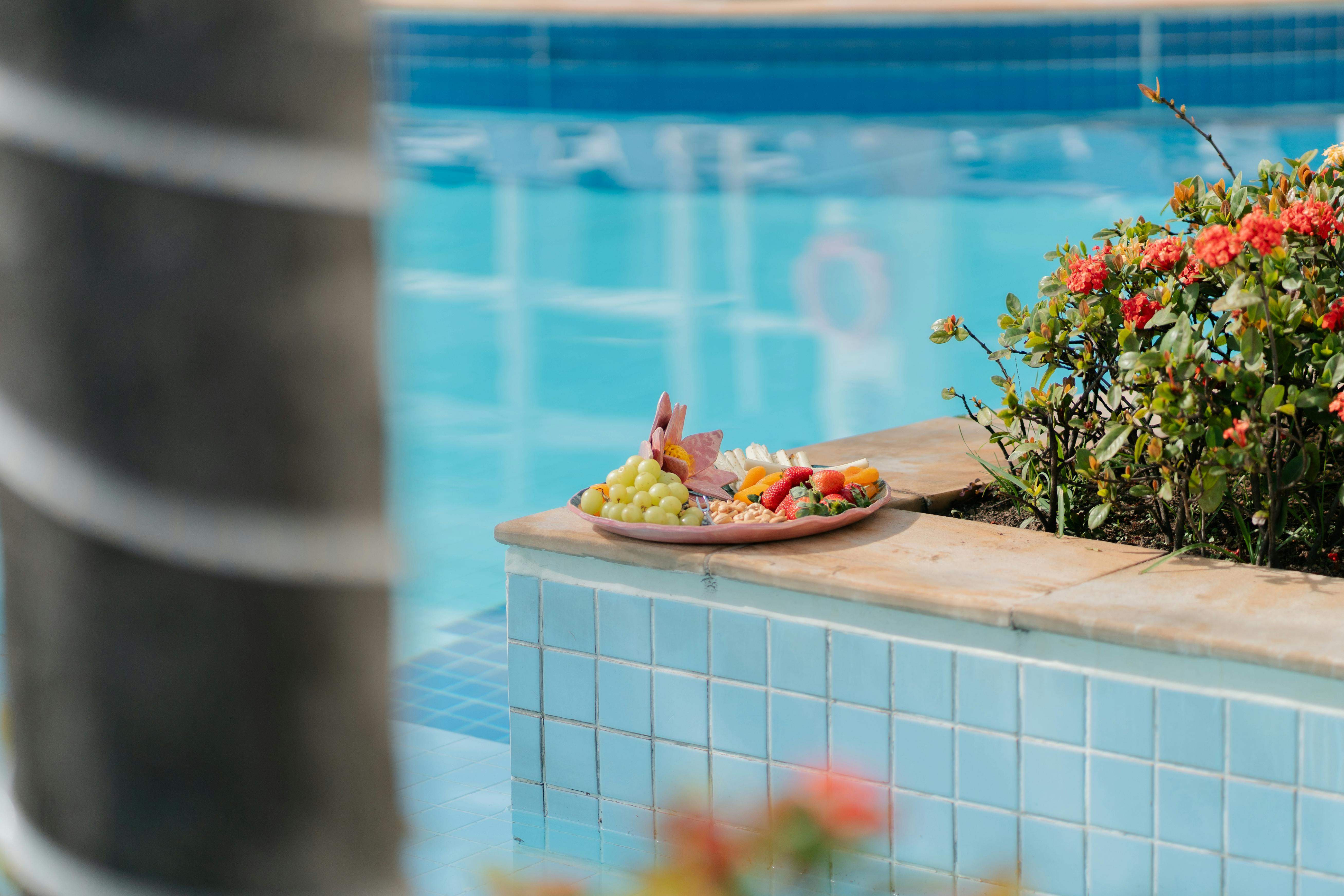 Sunny Poolside Fruit Platter with Refreshing Vibes · Free Stock Photo