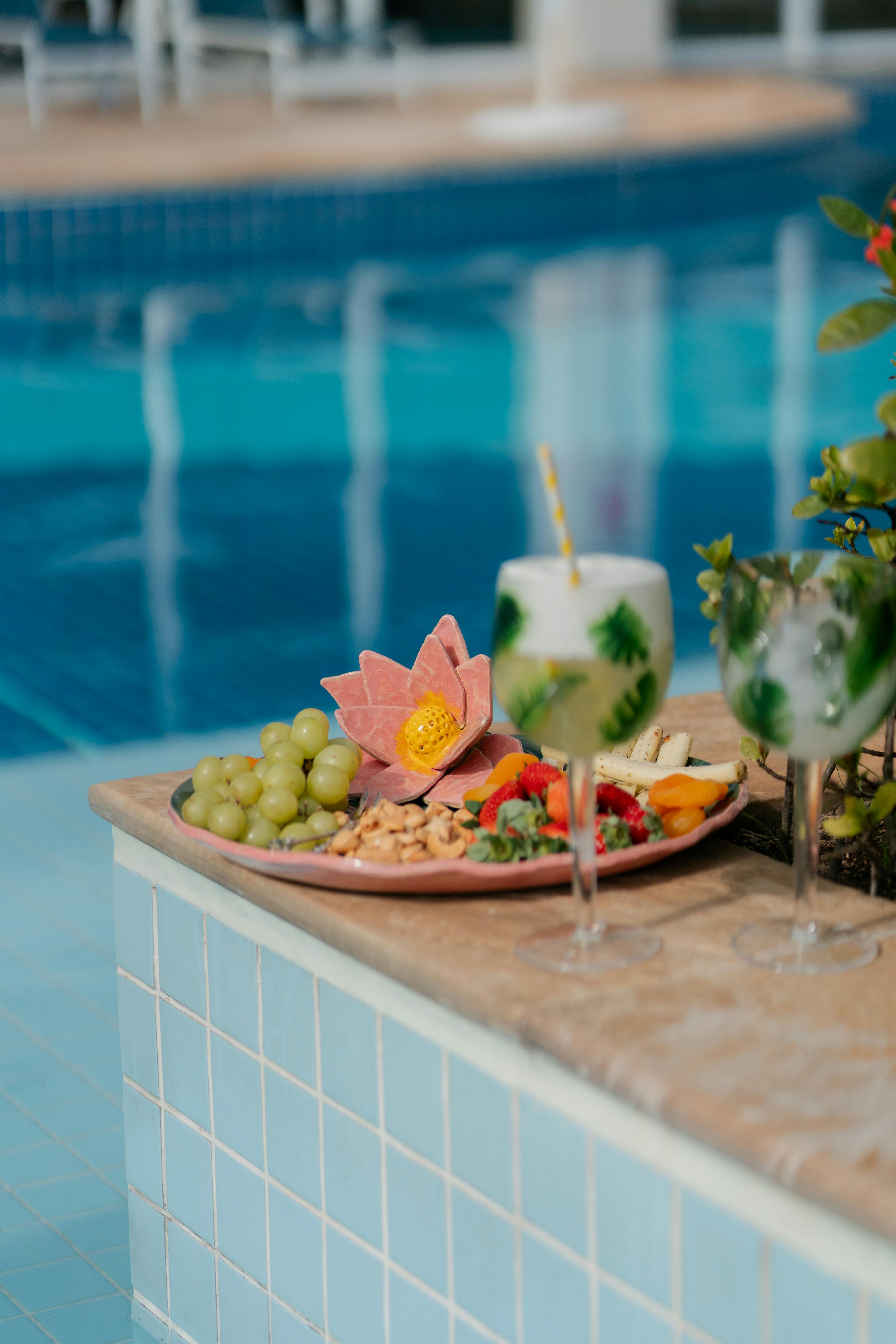 Refreshing Poolside Snack with Fruit and Drinks · Free Stock Photo