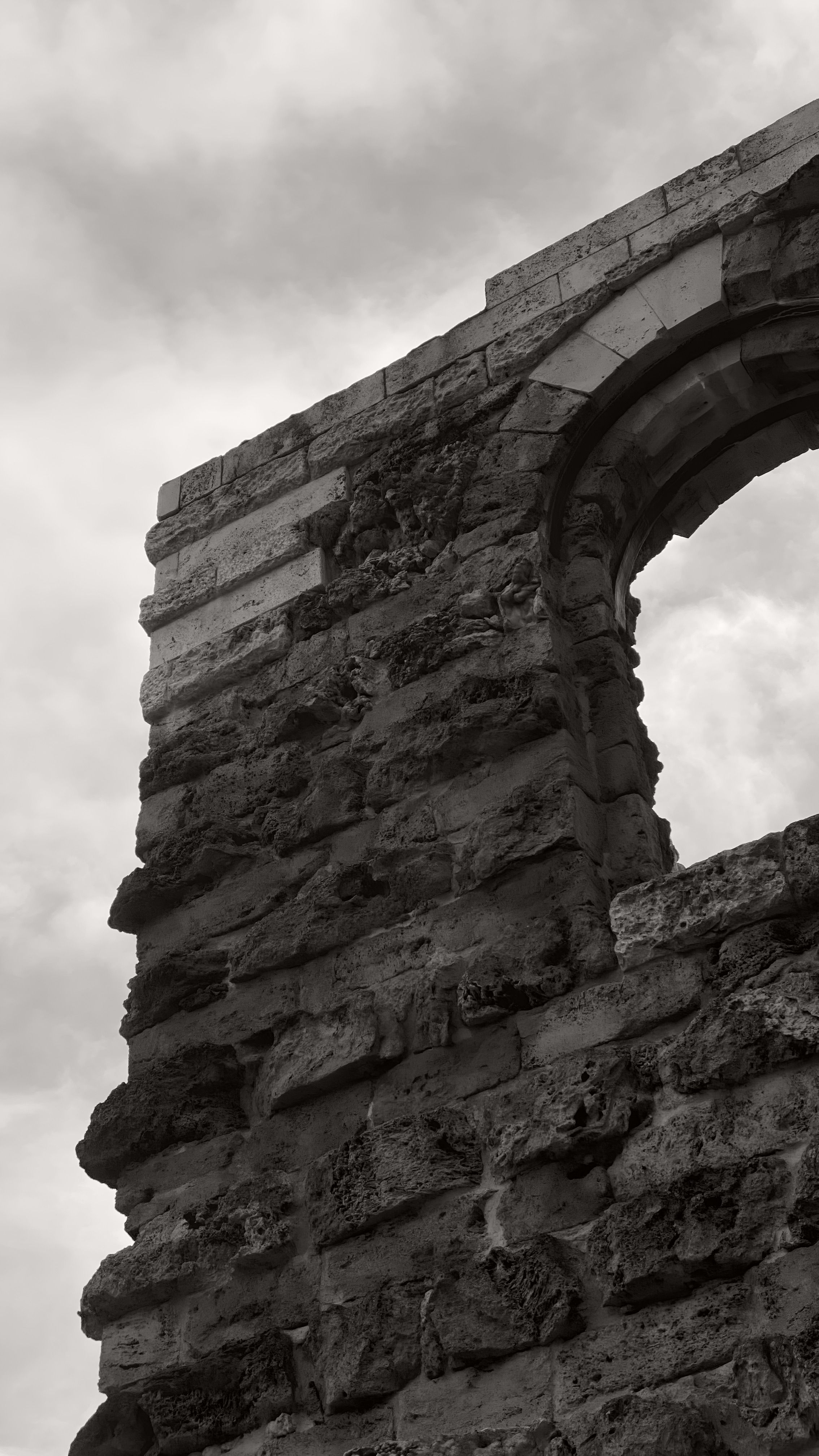 Ancient Stone Arch Against Dramatic Sky · Free Stock Photo