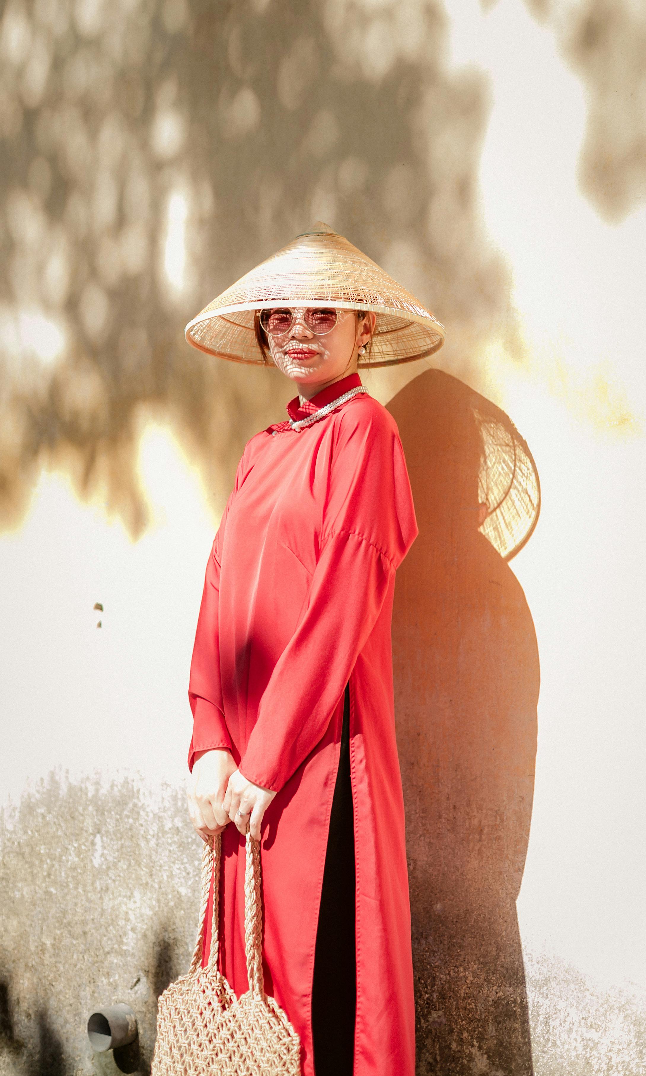 Traditional Vietnamese Outfit in Sunlit Portrait · Free Stock Photo
