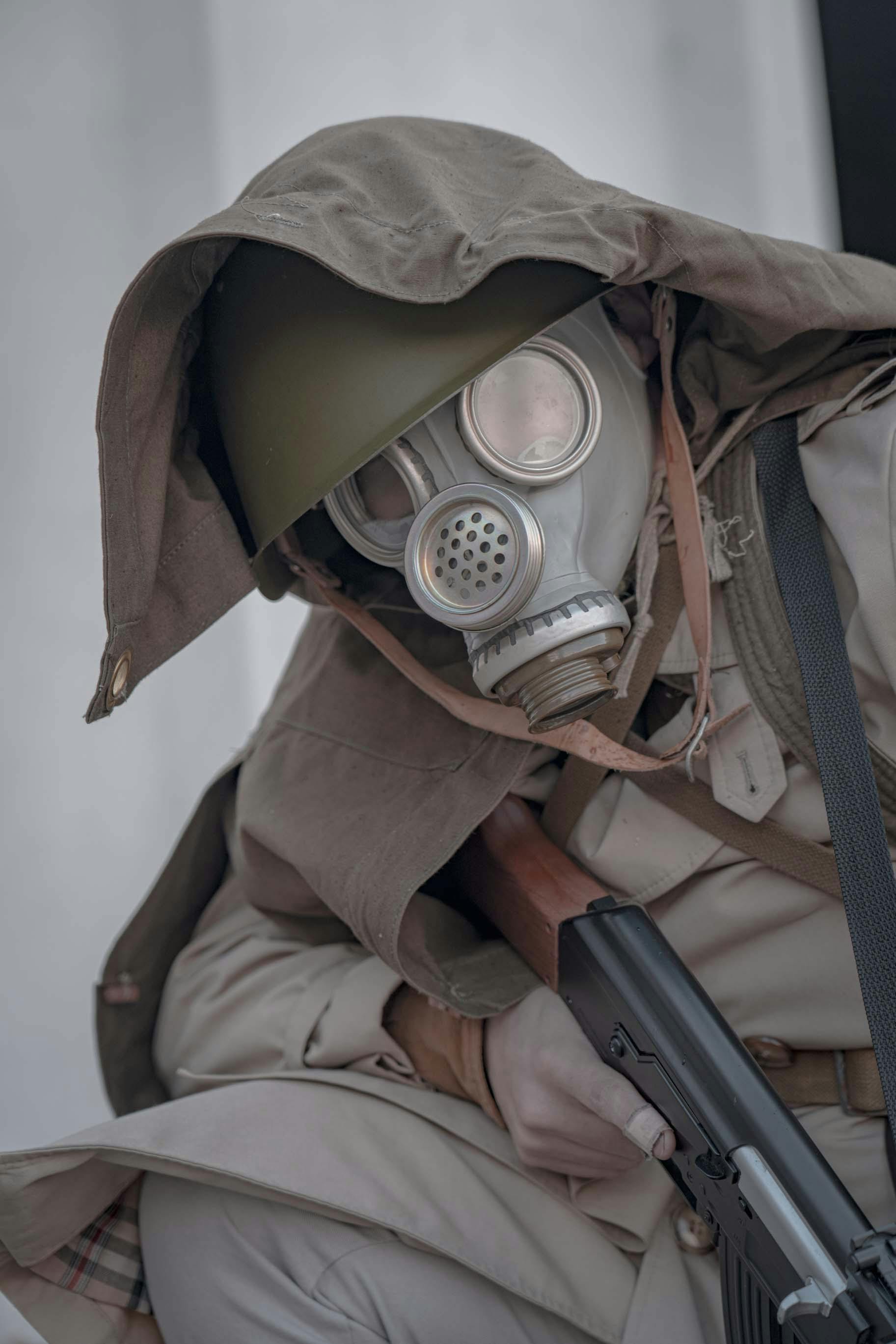 Military Cosplay with Gas Mask and Rifle · Free Stock Photo
