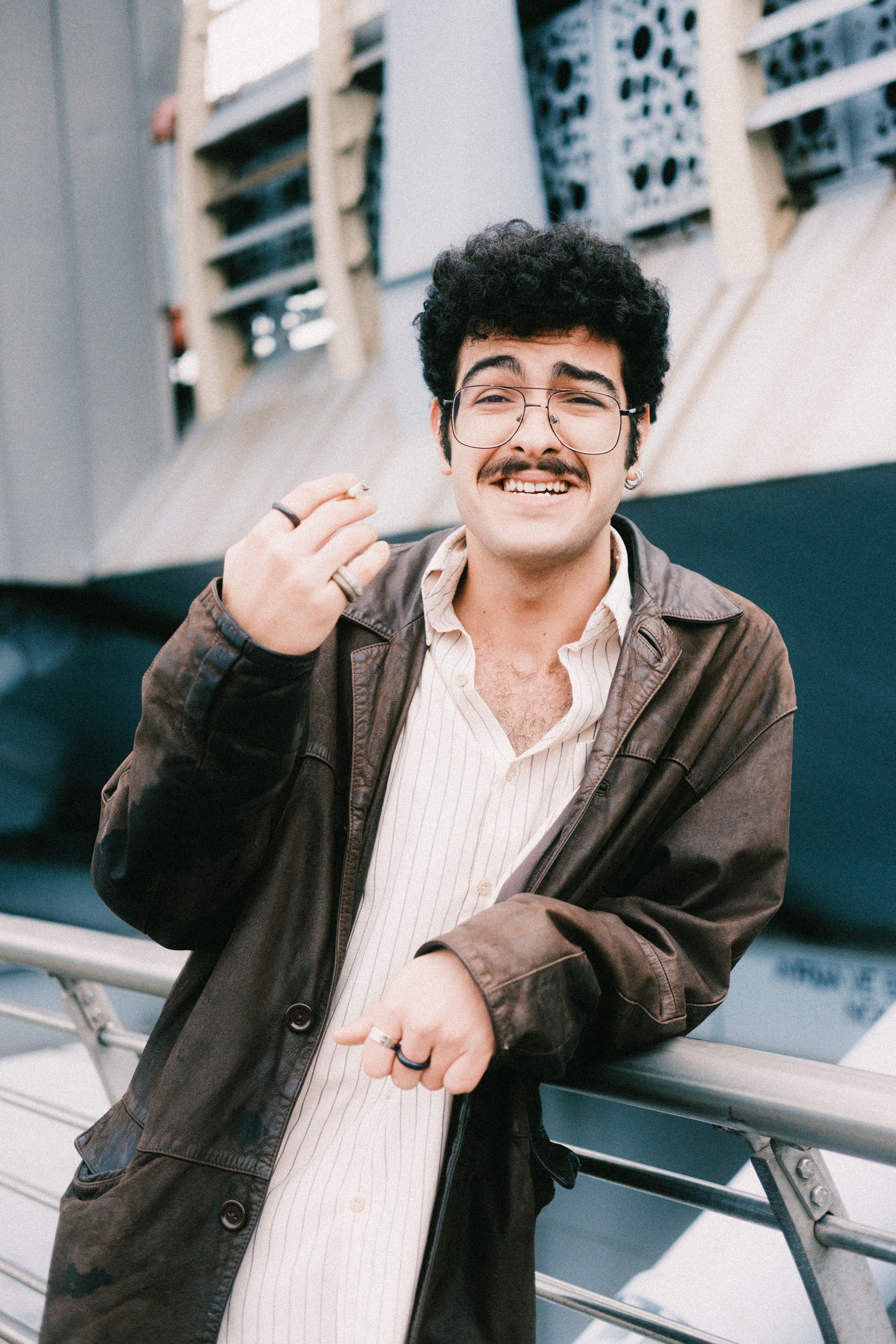 Young Man with Mustache Posing Outdoors · Free Stock Photo