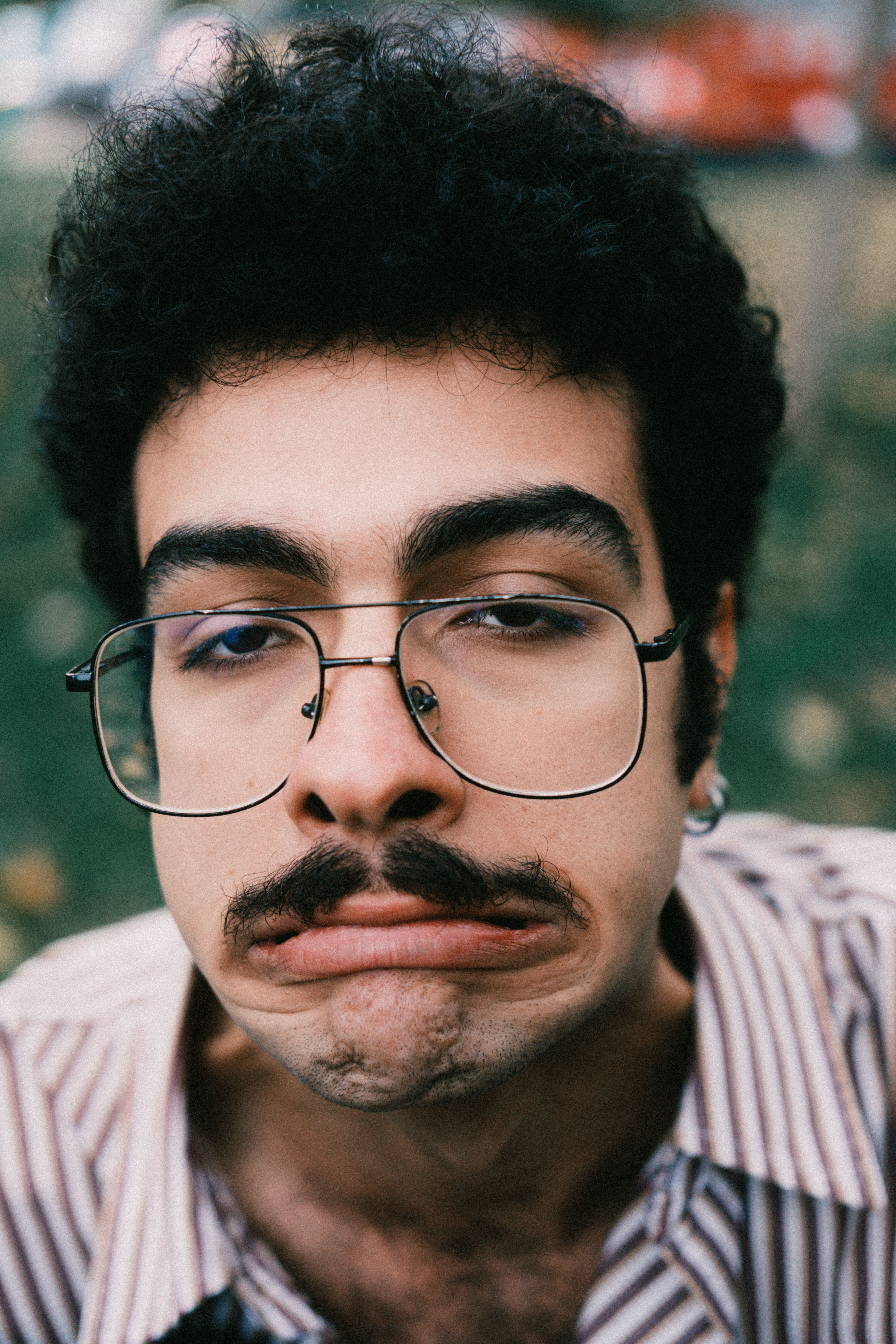 Quirky Portrait of Man with Glasses Outdoors · Free Stock Photo