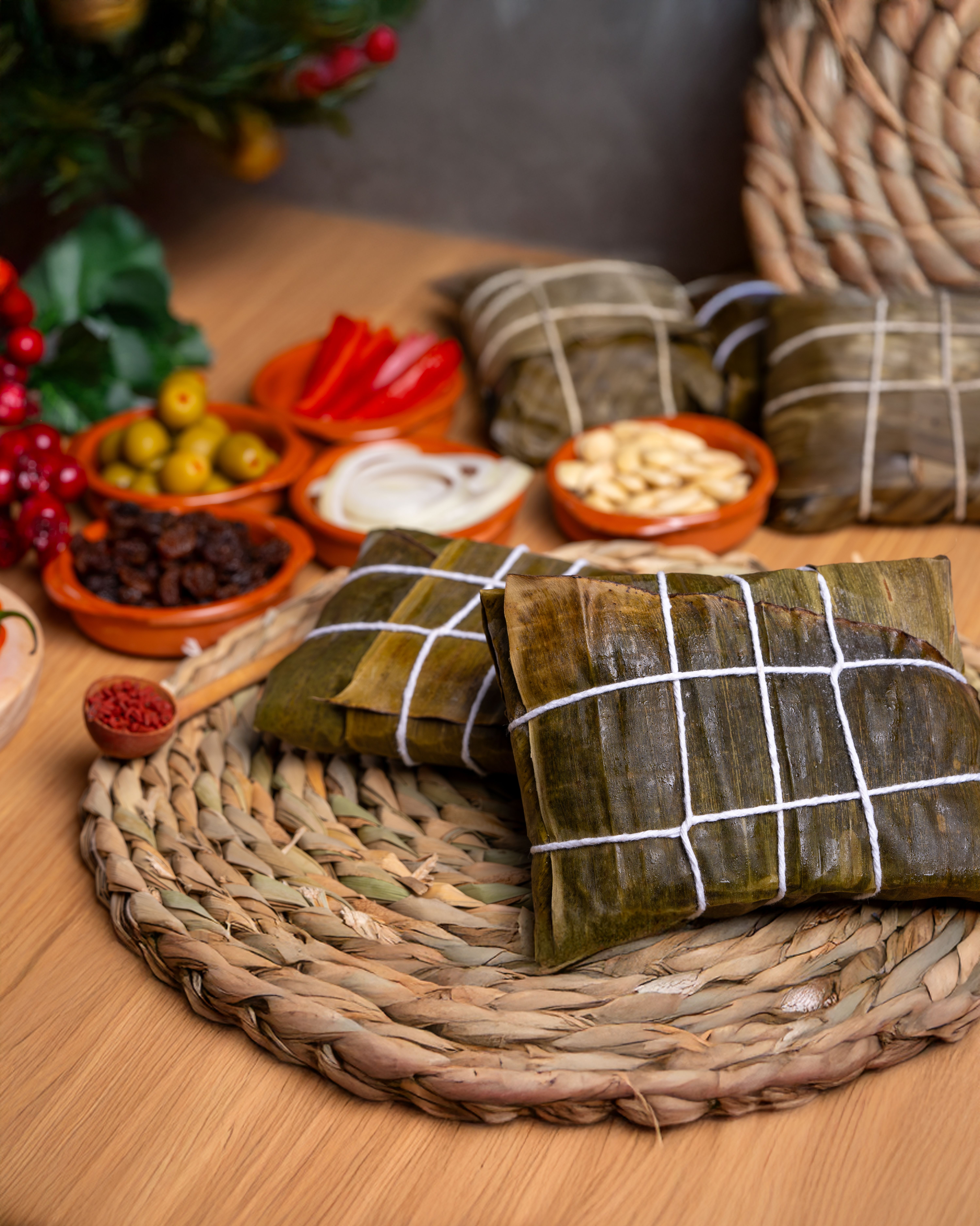 Traditional Wrapped Tamales on Woven Mat · Free Stock Photo