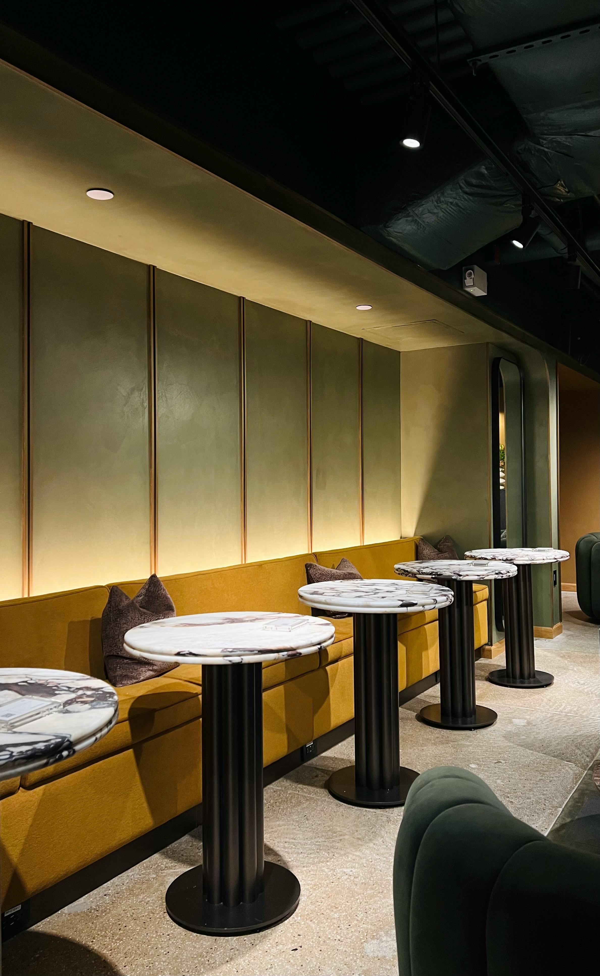 Chic Modern Cafe Interior with Marble Tables · Free Stock Photo
