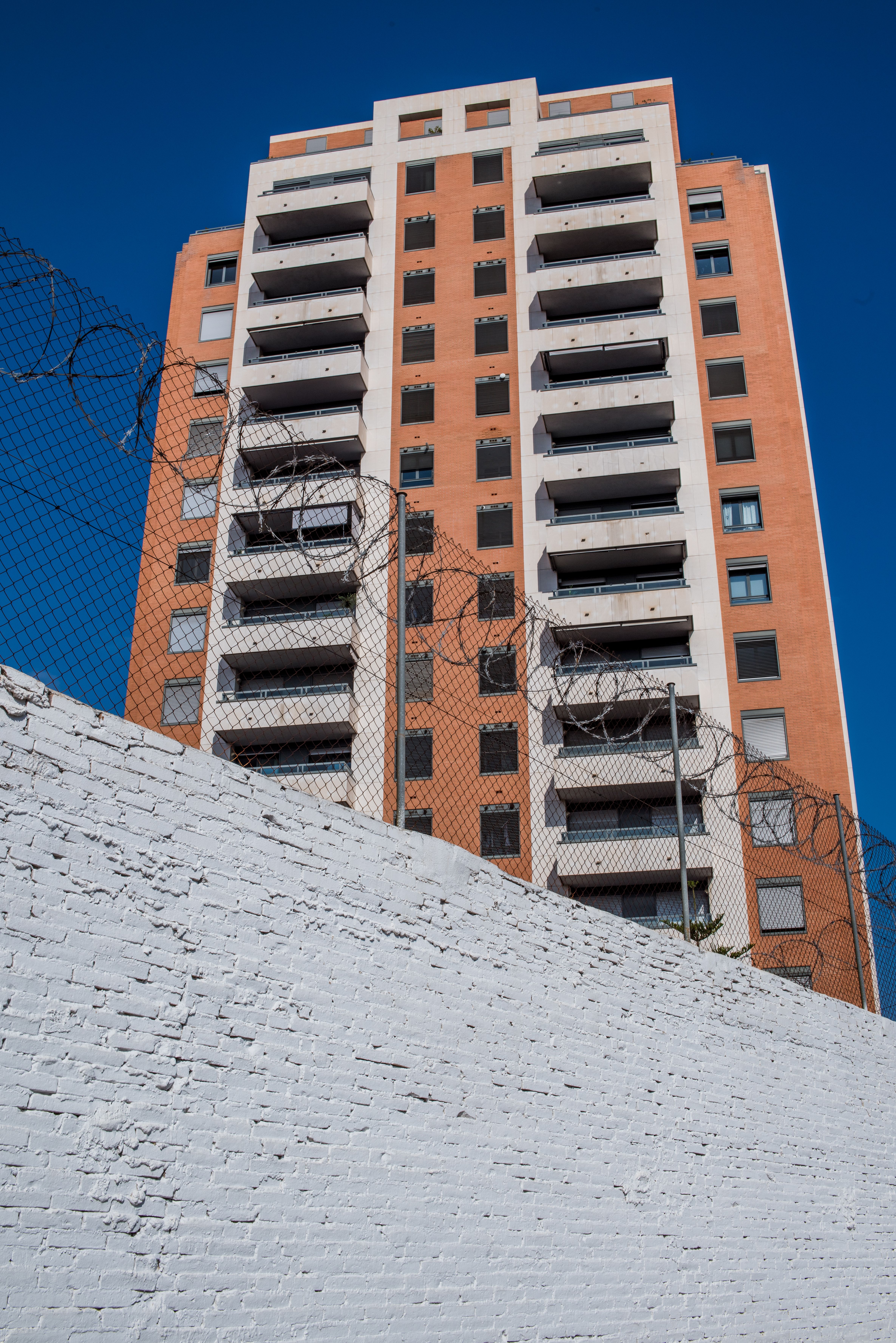 High-Rise Building Against Clear Blue Sky · Free Stock Photo