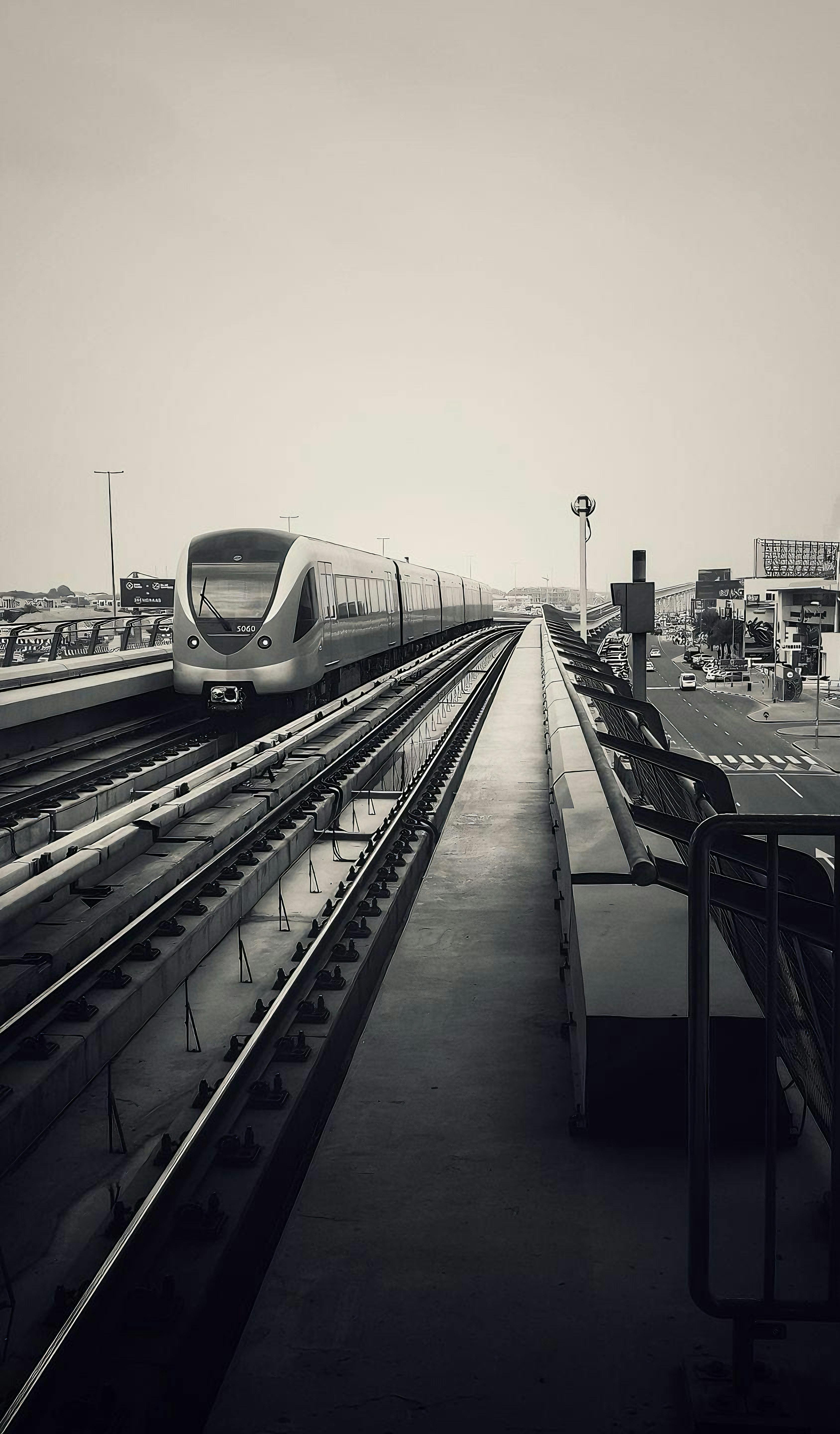 Sleek Metro Train on Elevated Urban Railway · Free Stock Photo