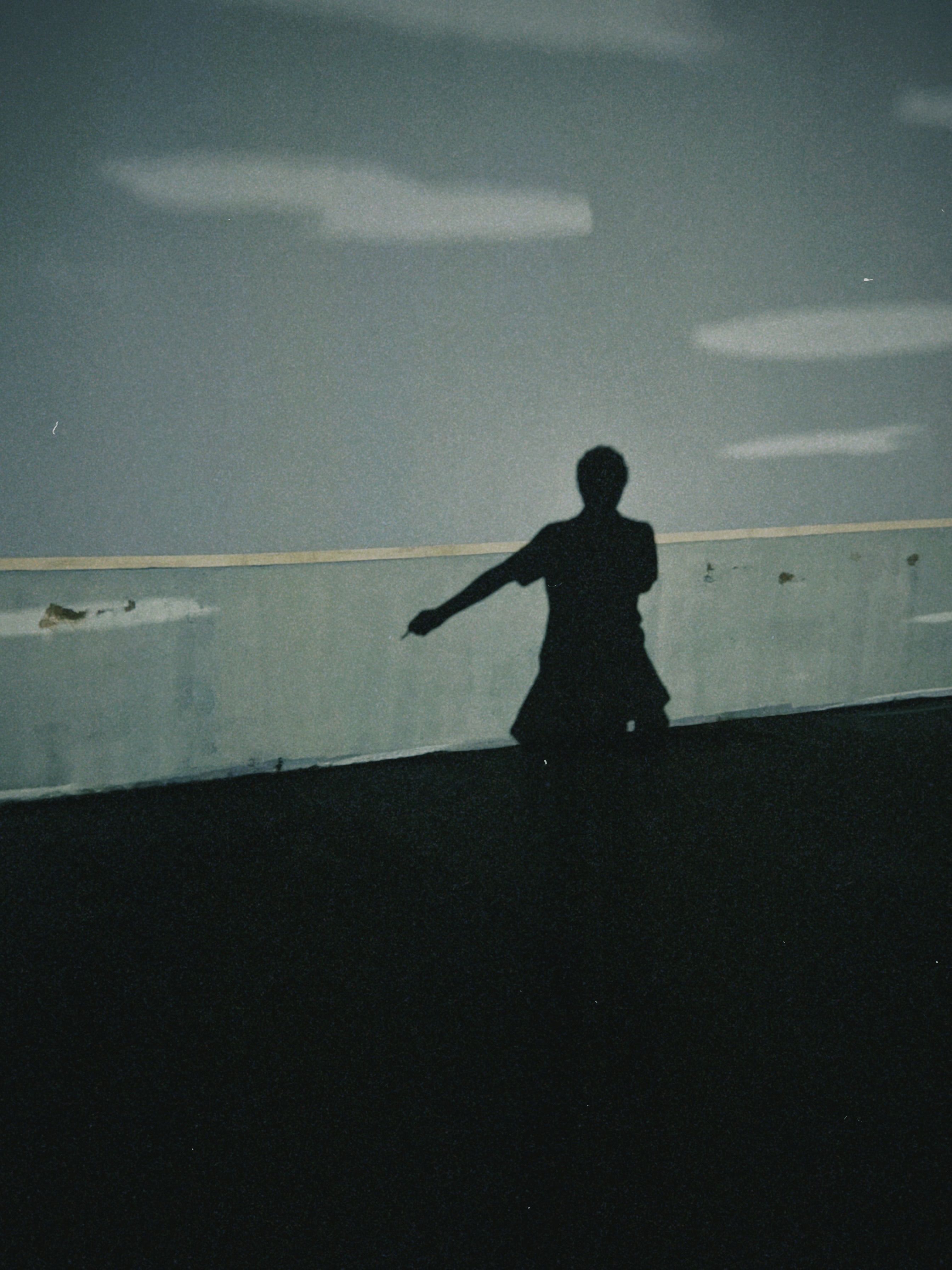 Mysterious Shadow Against Concrete Wall · Free Stock Photo