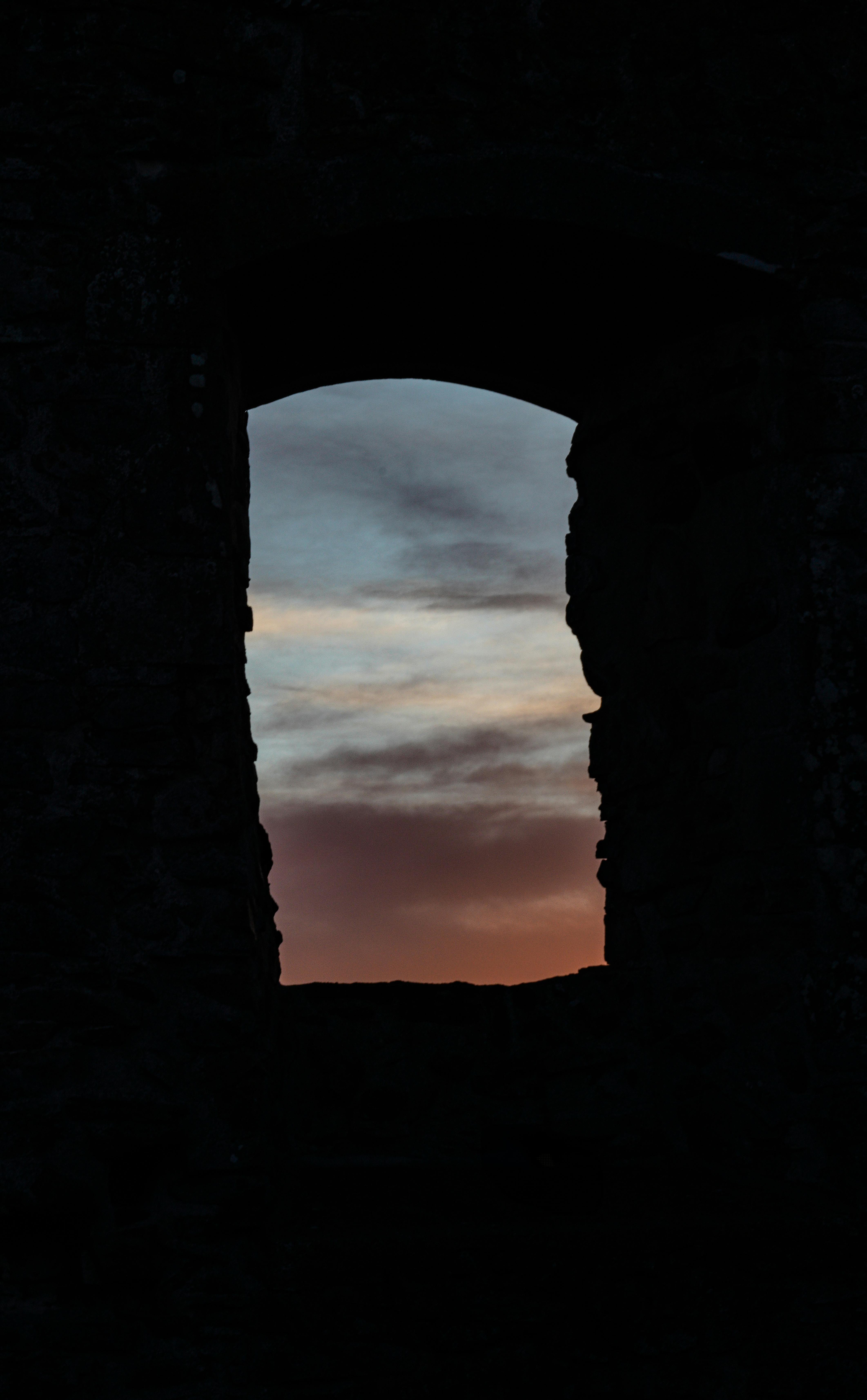 Sunrise View Through Old Stone Window · Free Stock Photo