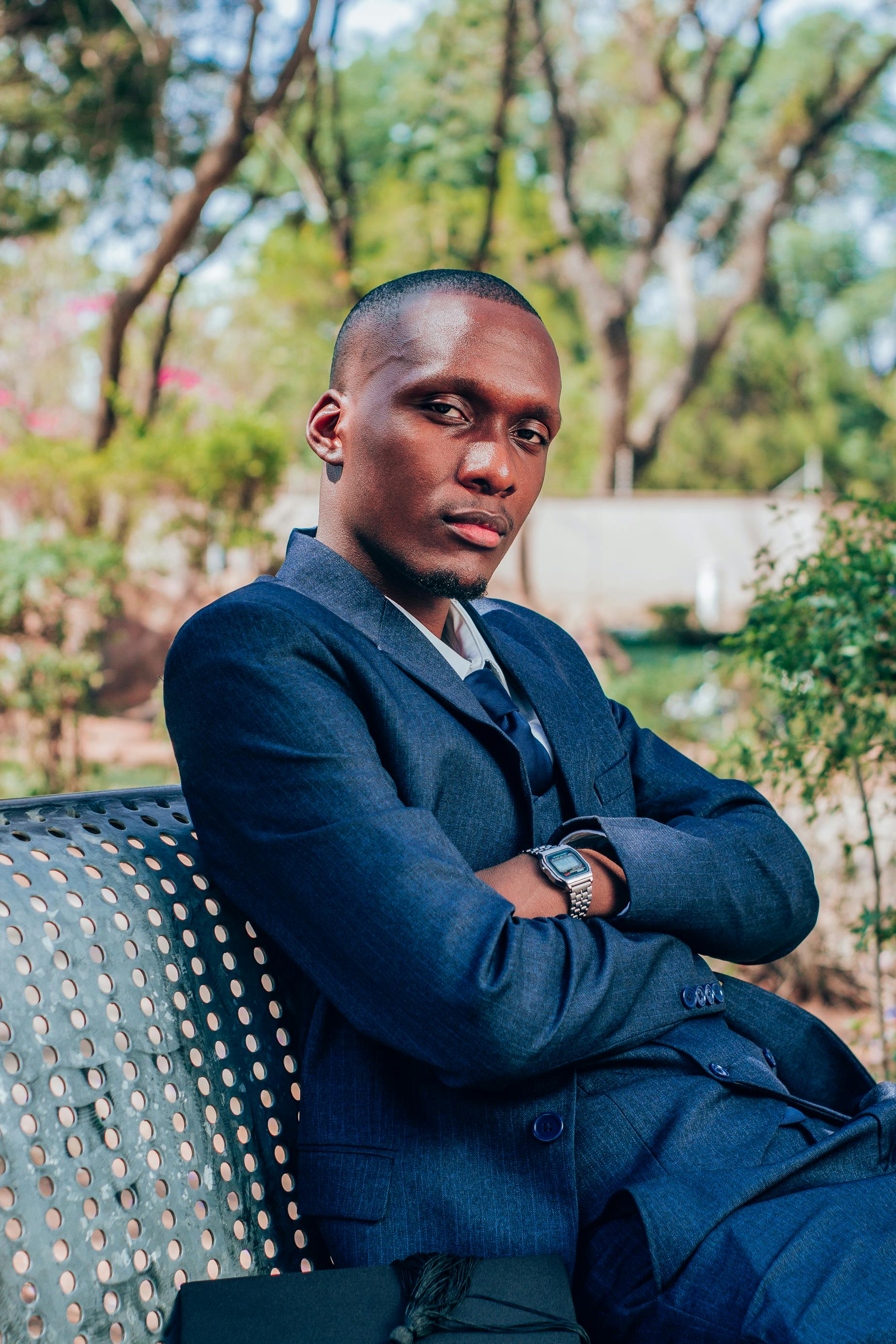 Confident Graduate in Blue Suit Celebrates Milestone · Free Stock Photo