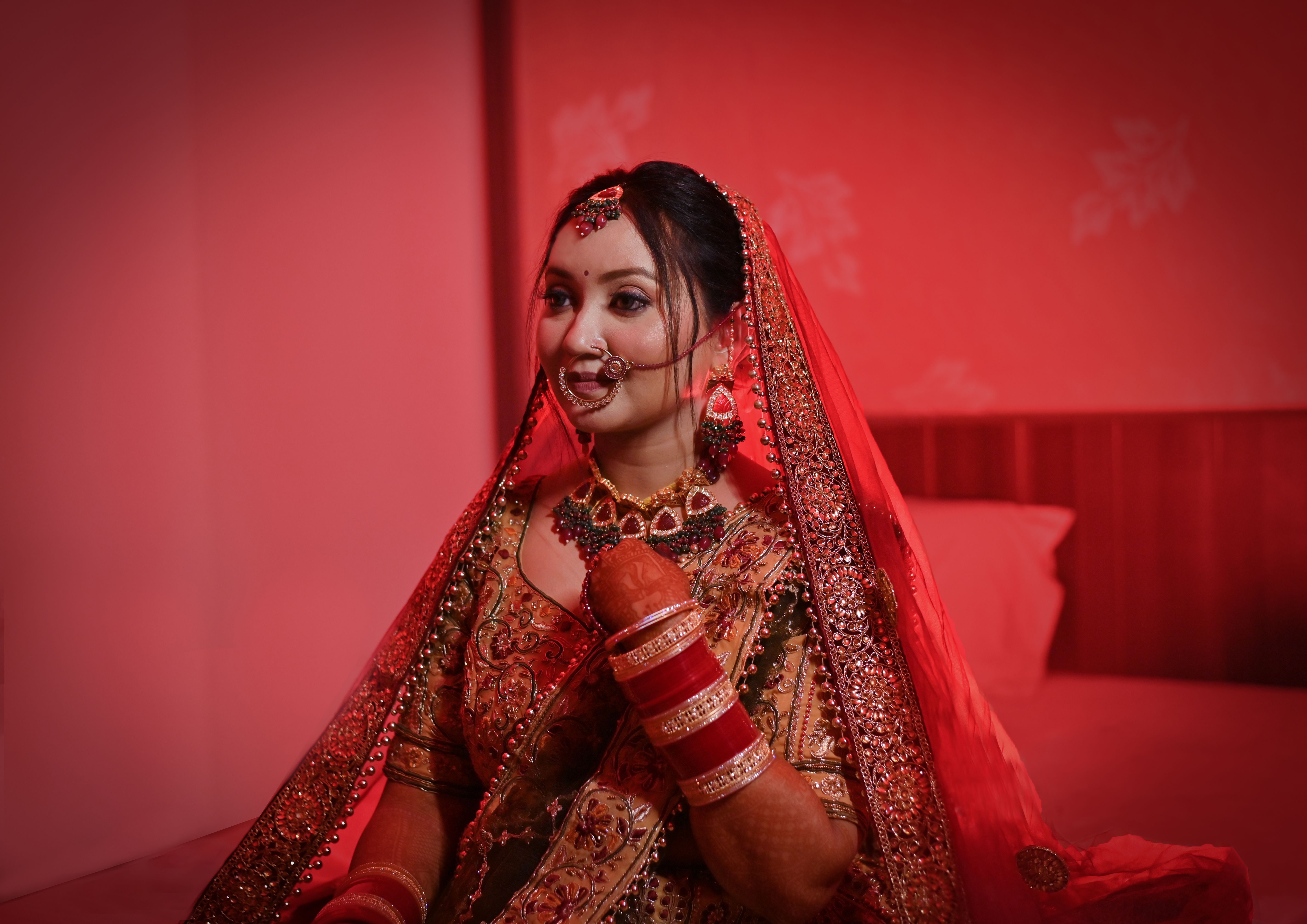 Elegant Bride in Traditional Red Bridal Attire · Free Stock Photo