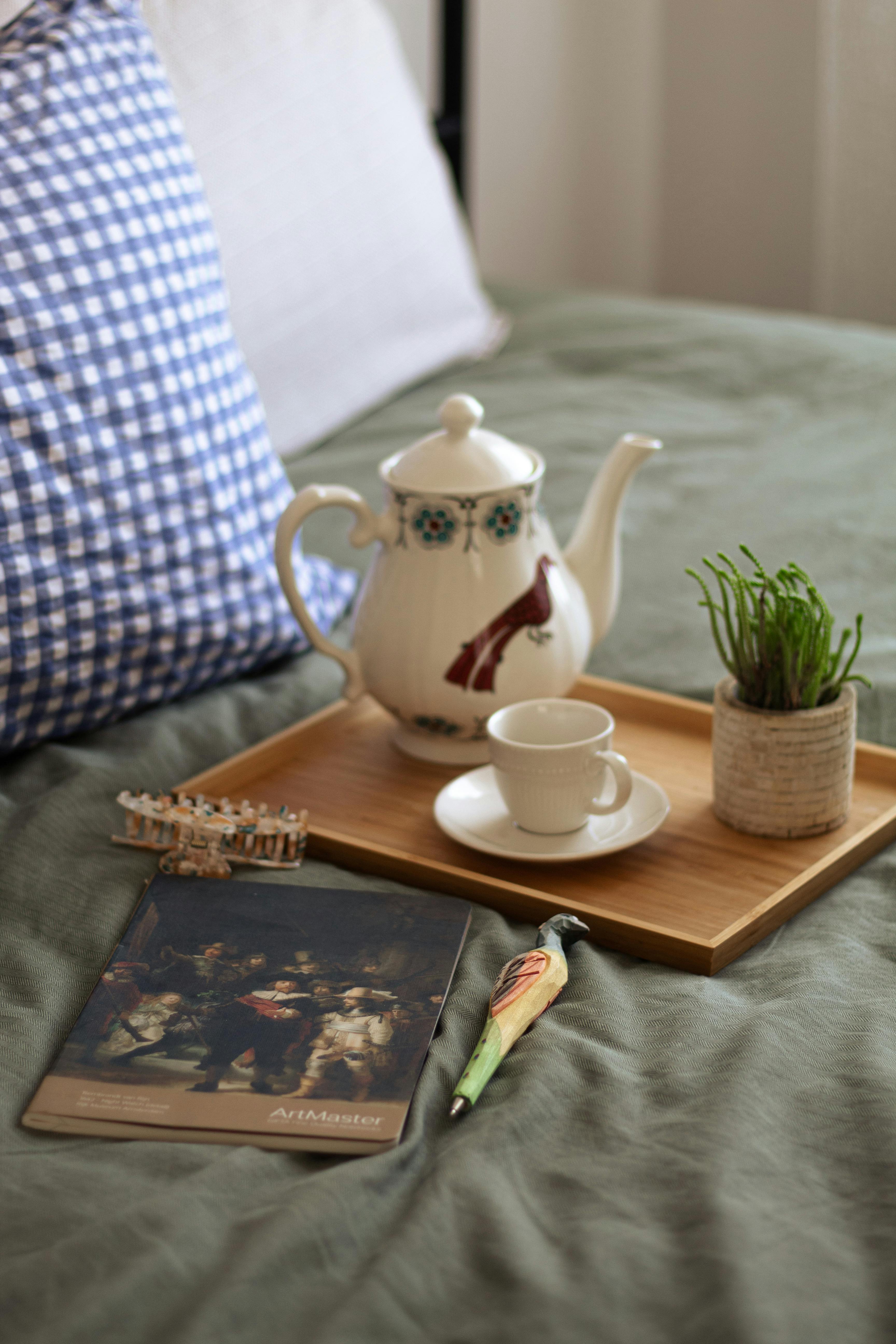 Cozy Bedside Setup with Tea and Reading Material · Free Stock Photo
