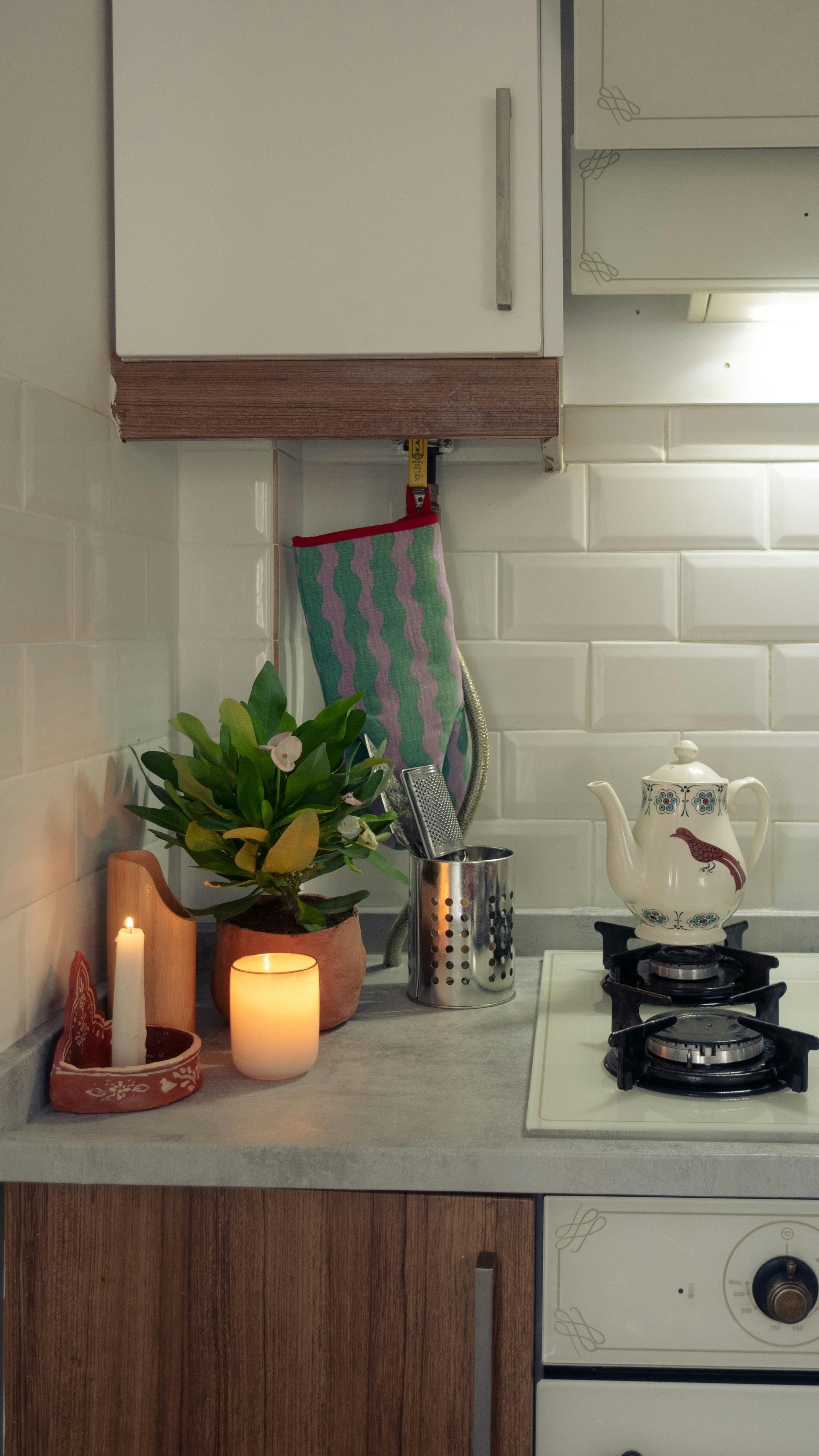 Cozy Kitchen Counter with Teapot and Candles · Free Stock Photo