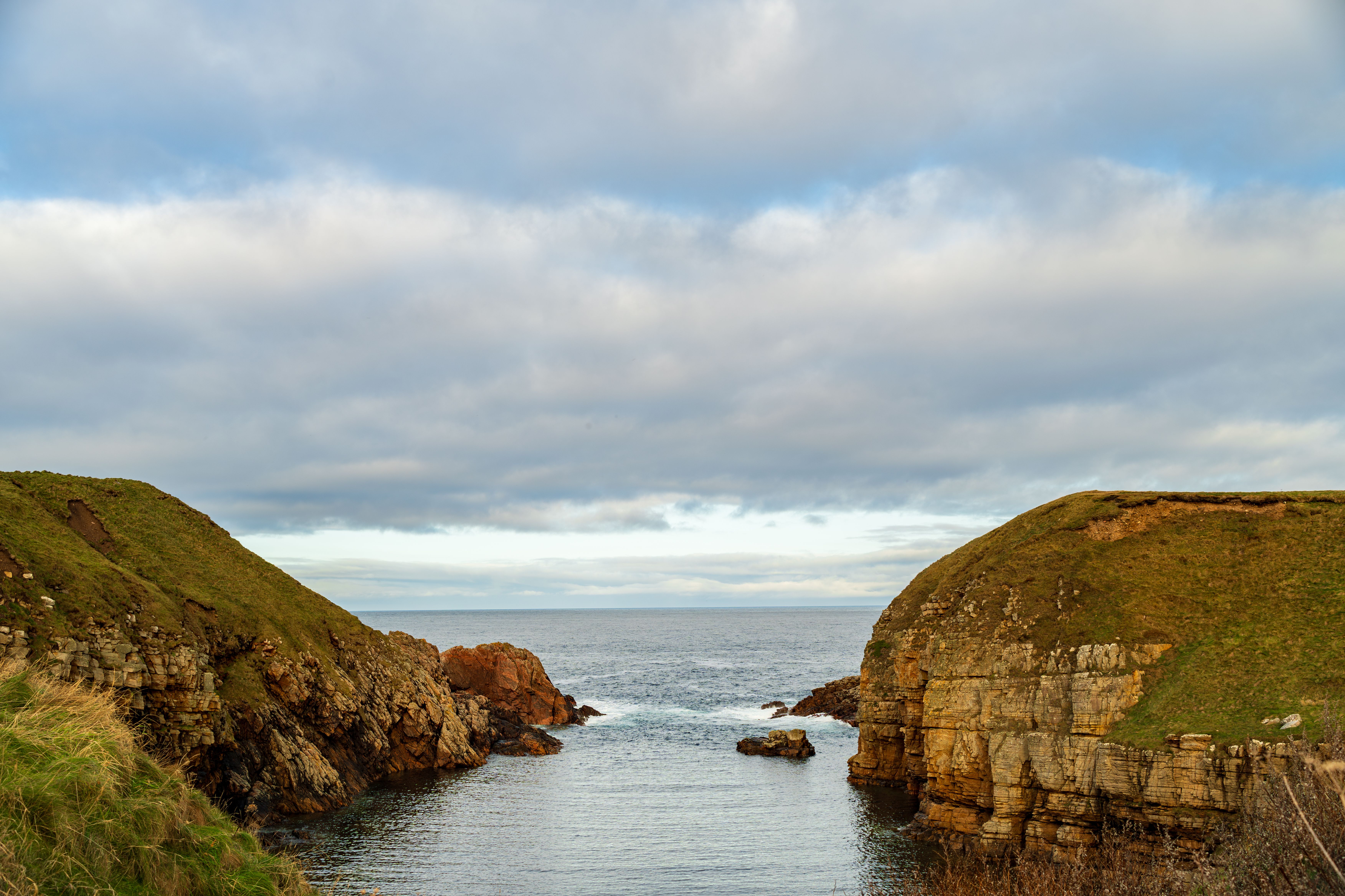 Scenic Coastal Cliffs Overlooking Calm Sea · Free Stock Photo