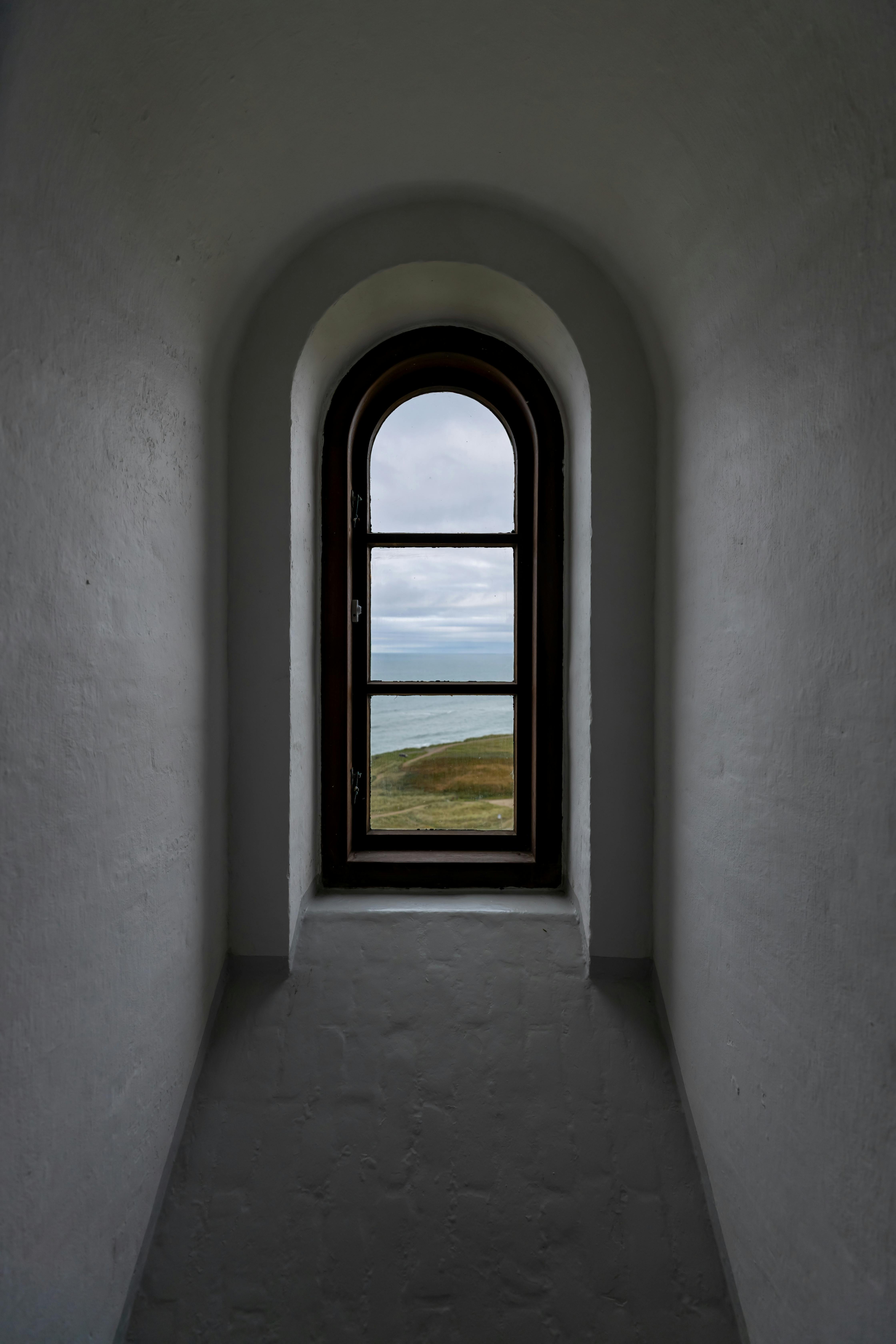 Scenic Coastal View Through Arch Window in Hirtshals · Free Stock Photo