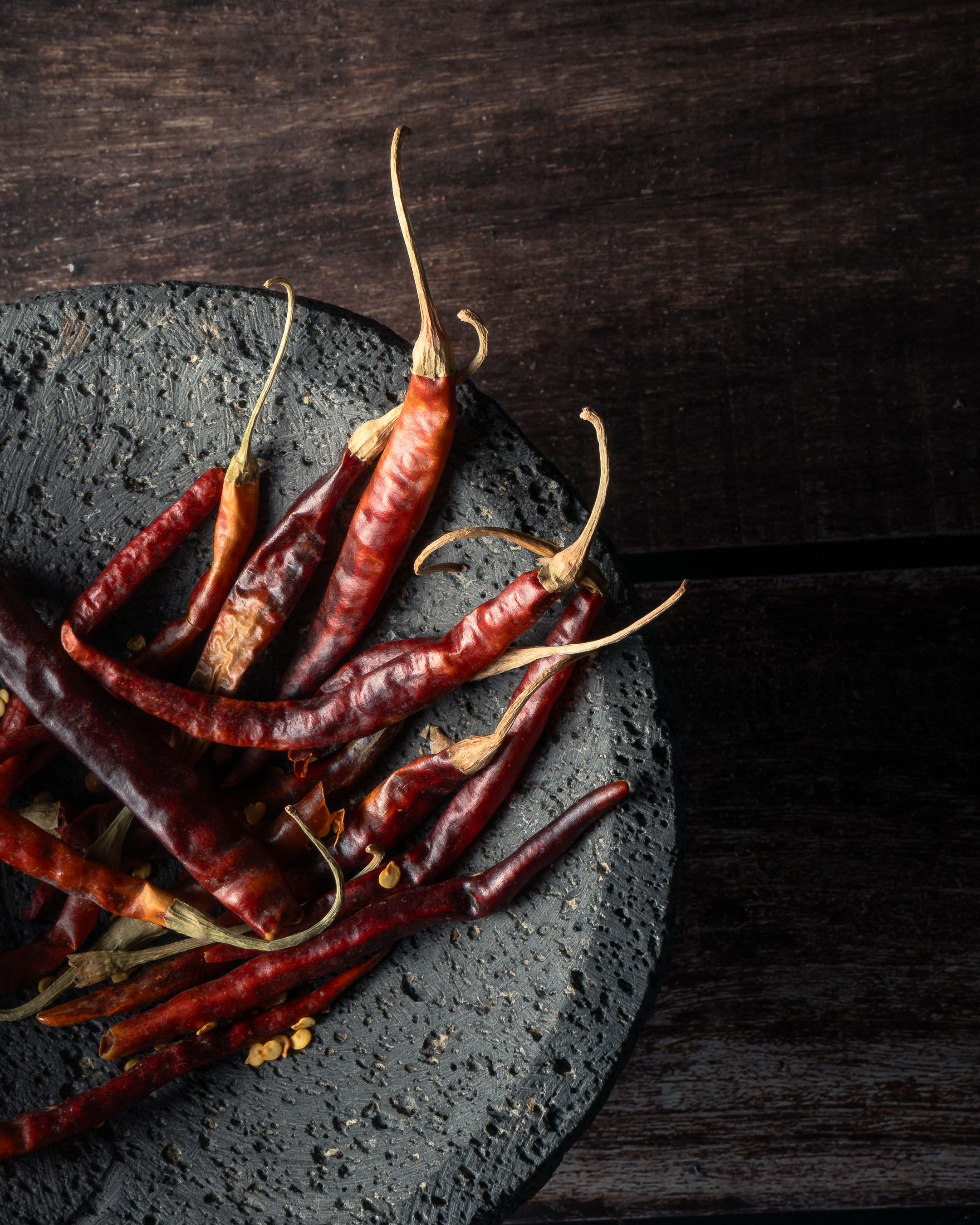 Fresh Red Chili Peppers on Rustic Stone Plate · Free Stock Photo