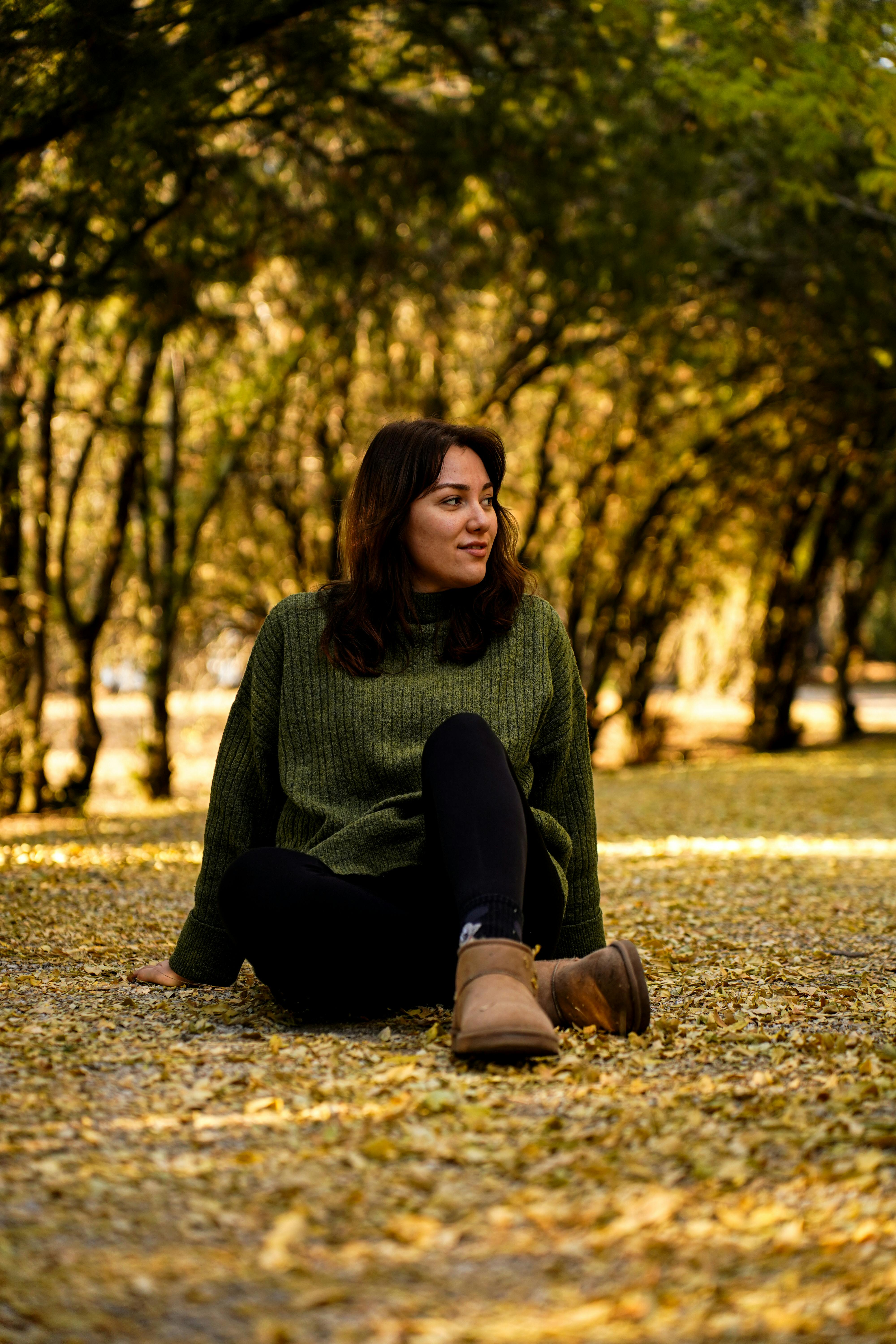 Woman Enjoying Autumn in Leaf-Covered Park · Free Stock Photo