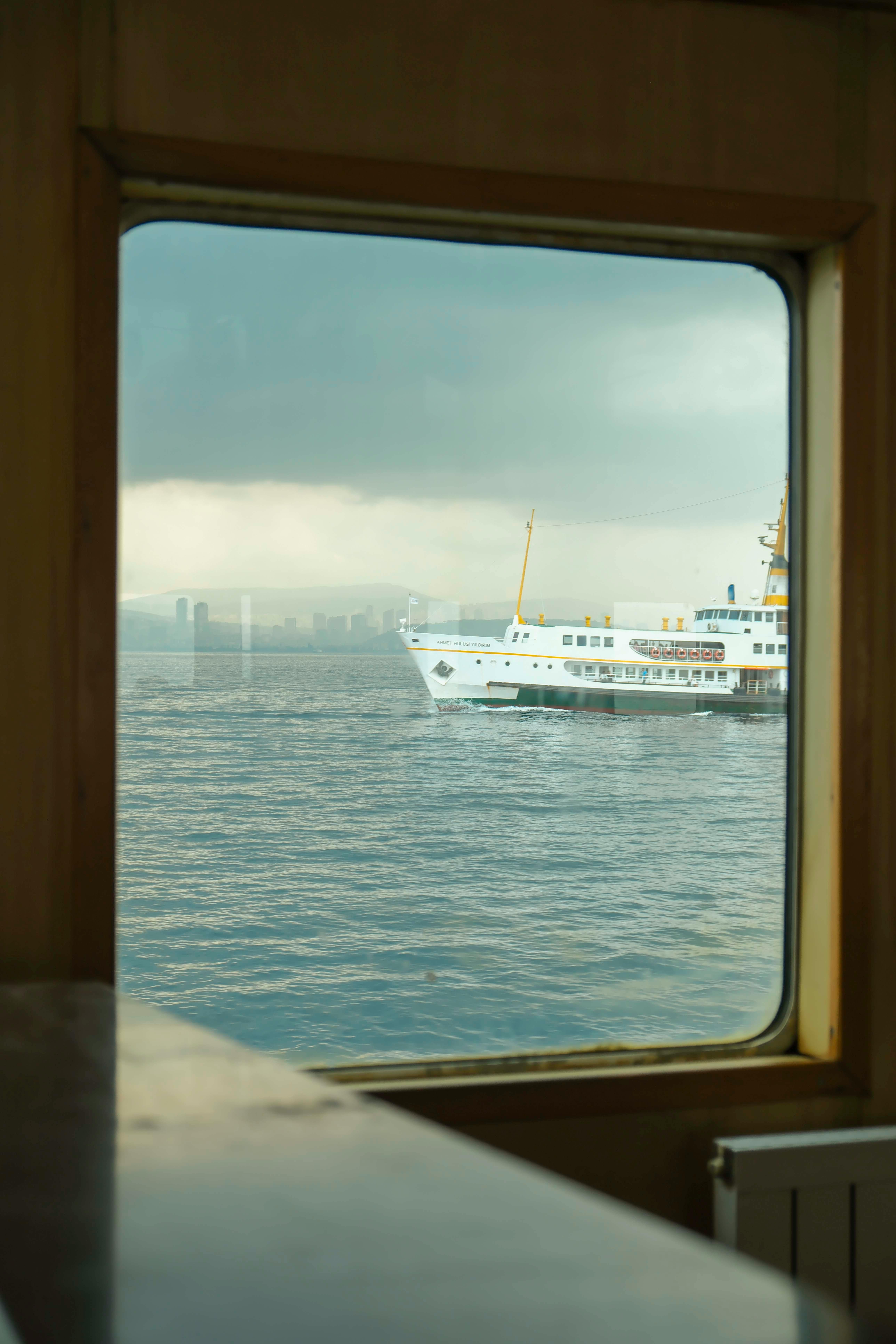Vibrant İstanbul Ferry View through Rustic Window · Free Stock Photo