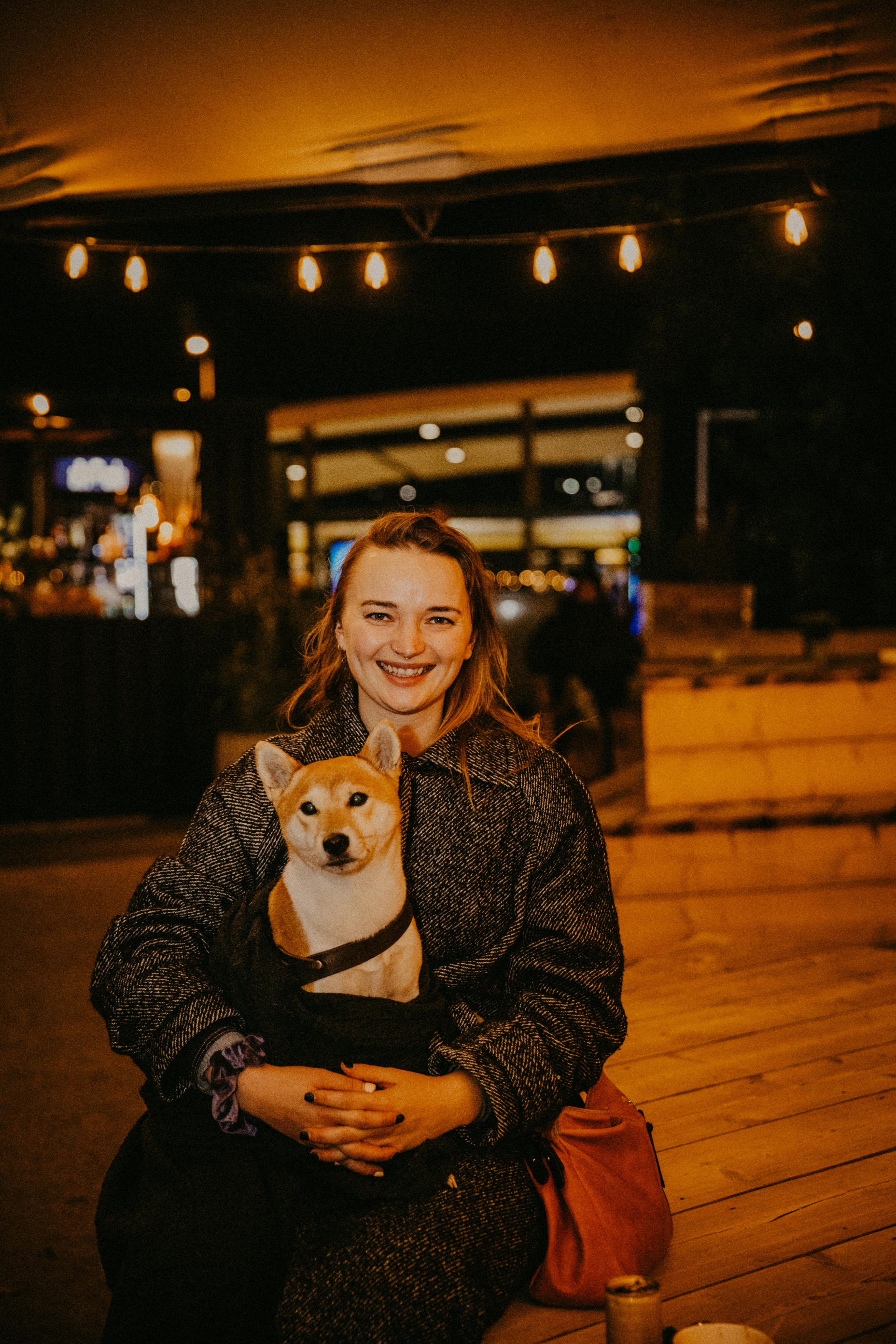 Woman Enjoying Night Outdoors with Shiba Inu · Free Stock Photo