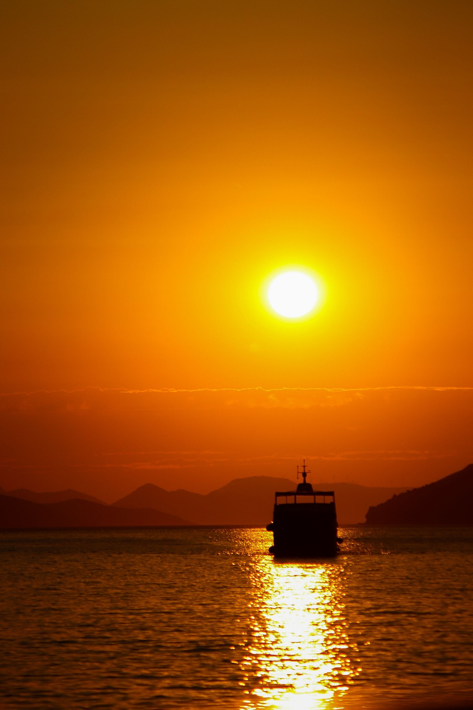 Sunset Boat Ride in Dubrovnik's Golden Waters · Free Stock Photo