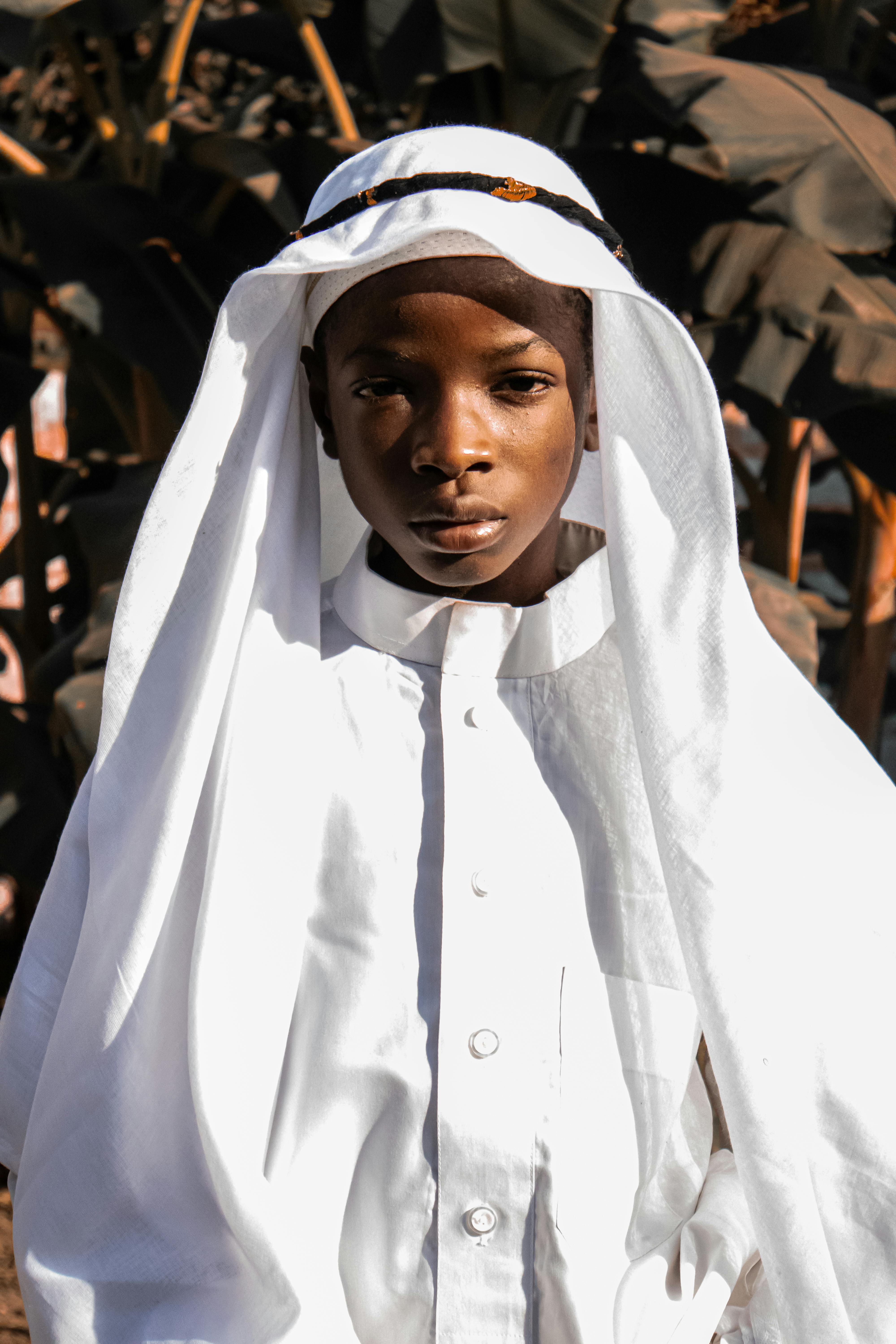 Portrait of a Young Boy in Traditional Attire · Free Stock Photo