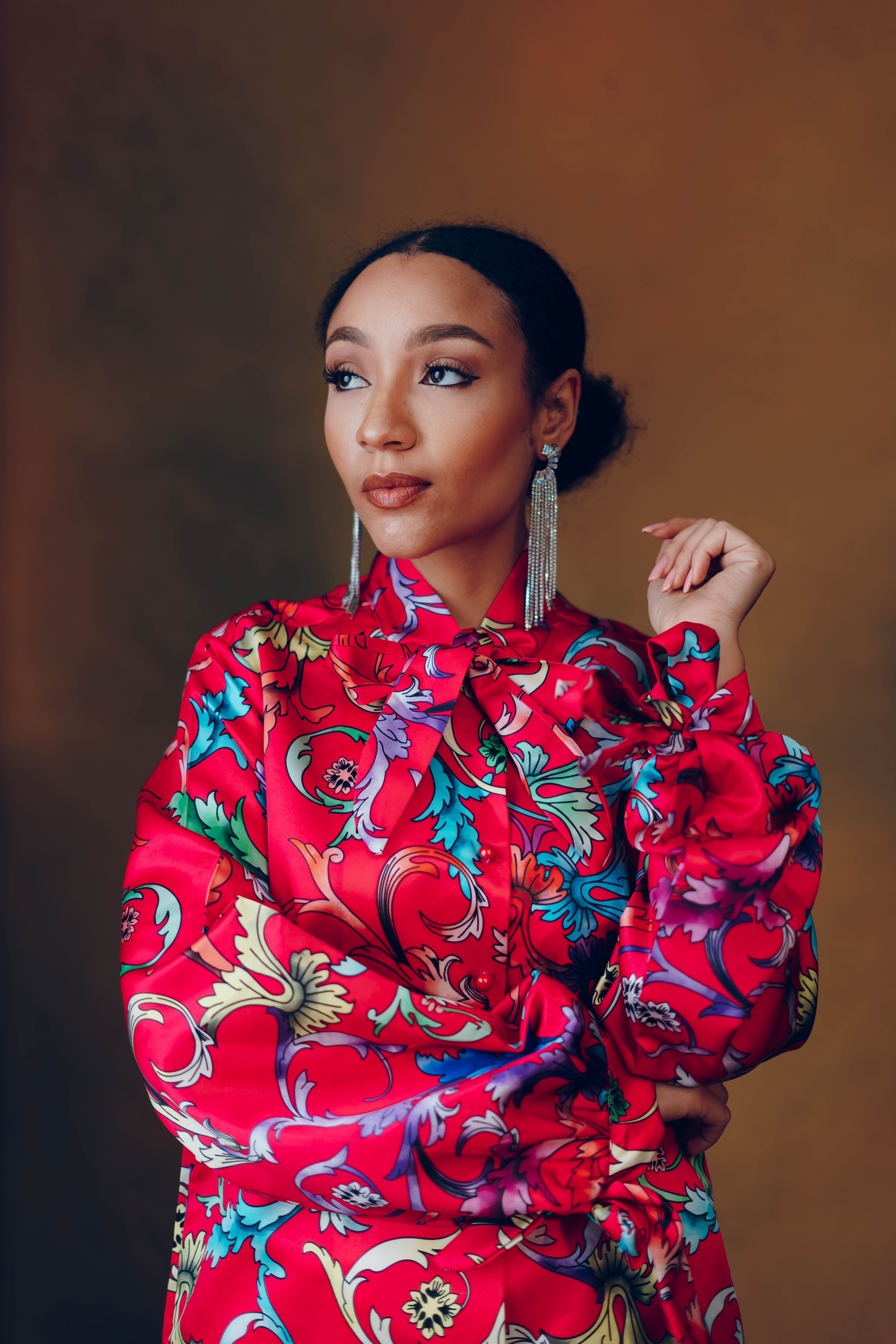 Elegant Portrait of Black Fashion Model in Floral Dress · Free Stock Photo