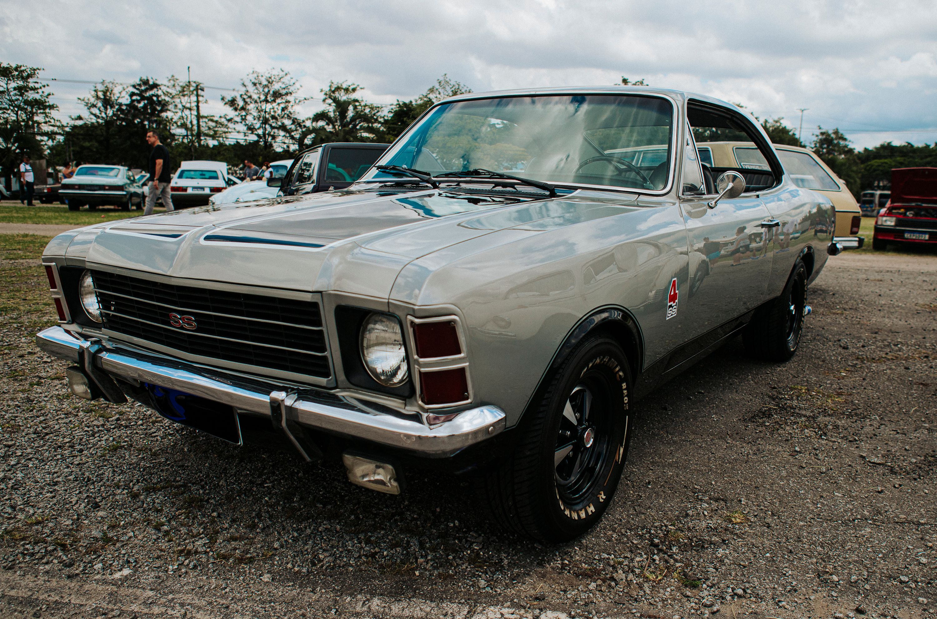 Classic Grey Muscle Car at Outdoor Auto Show · Free Stock Photo