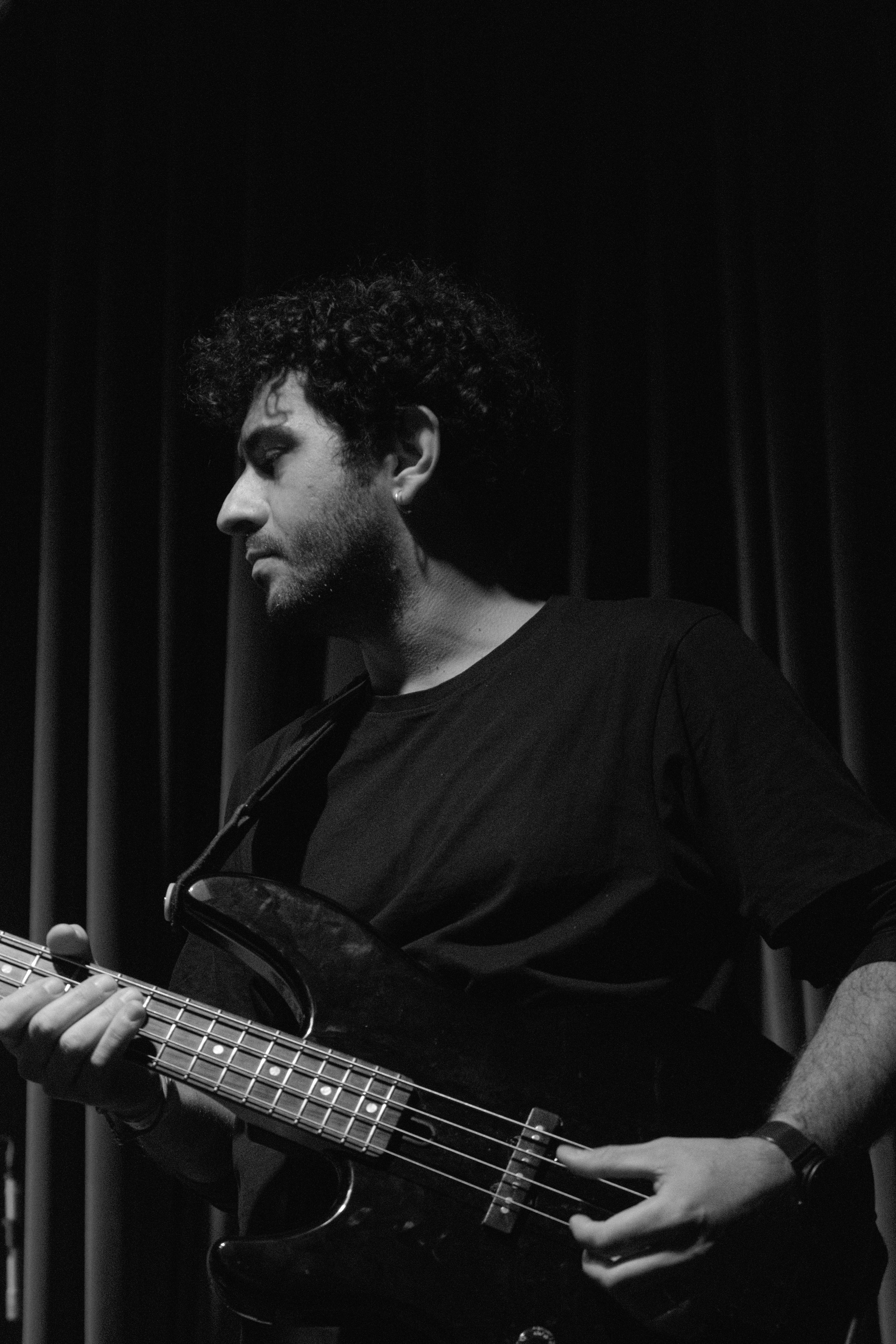 Black and White Portrait of a Bass Guitarist · Free Stock Photo