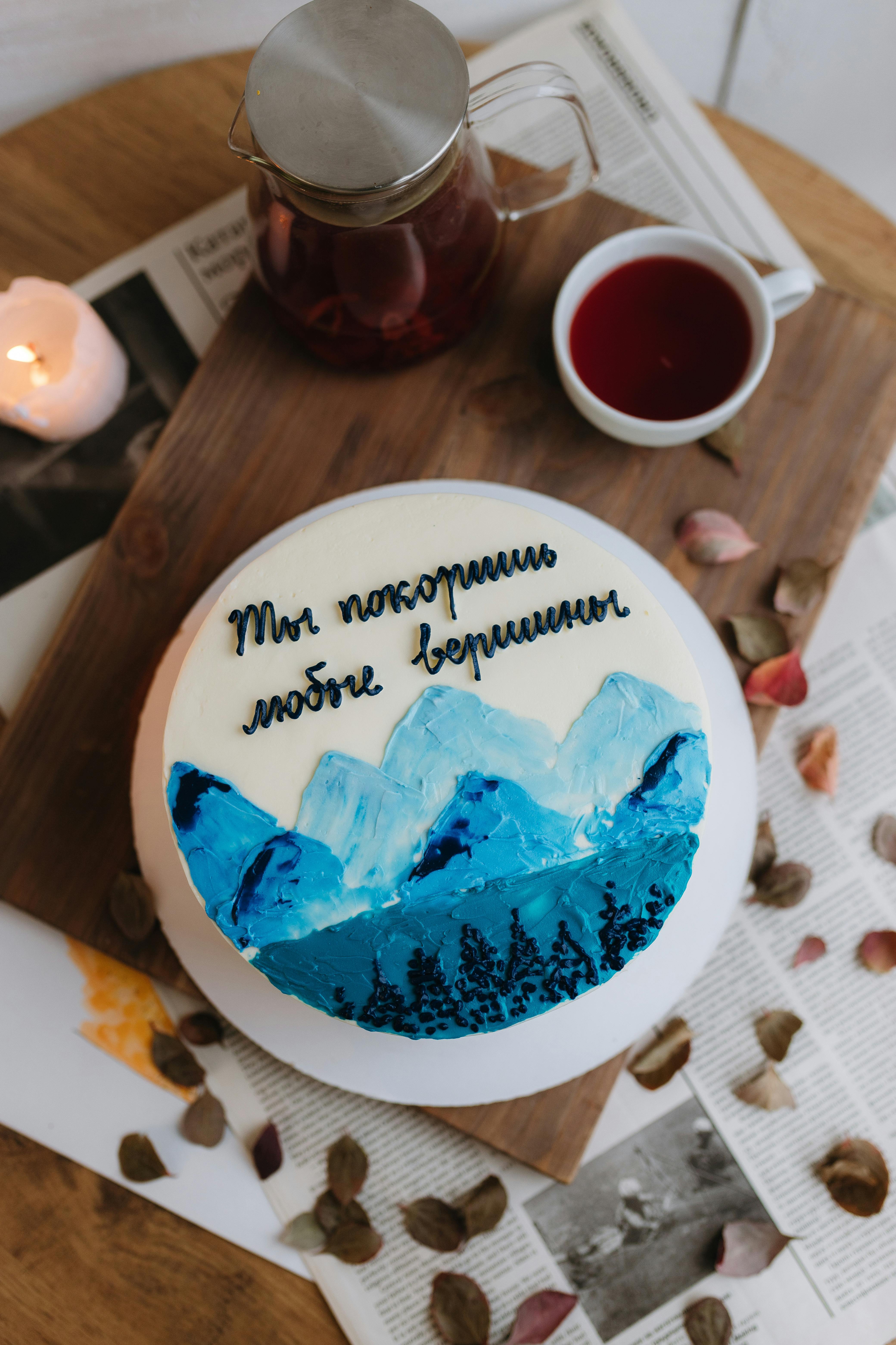 Decorative Cake with Scenic Mountain Design · Free Stock Photo