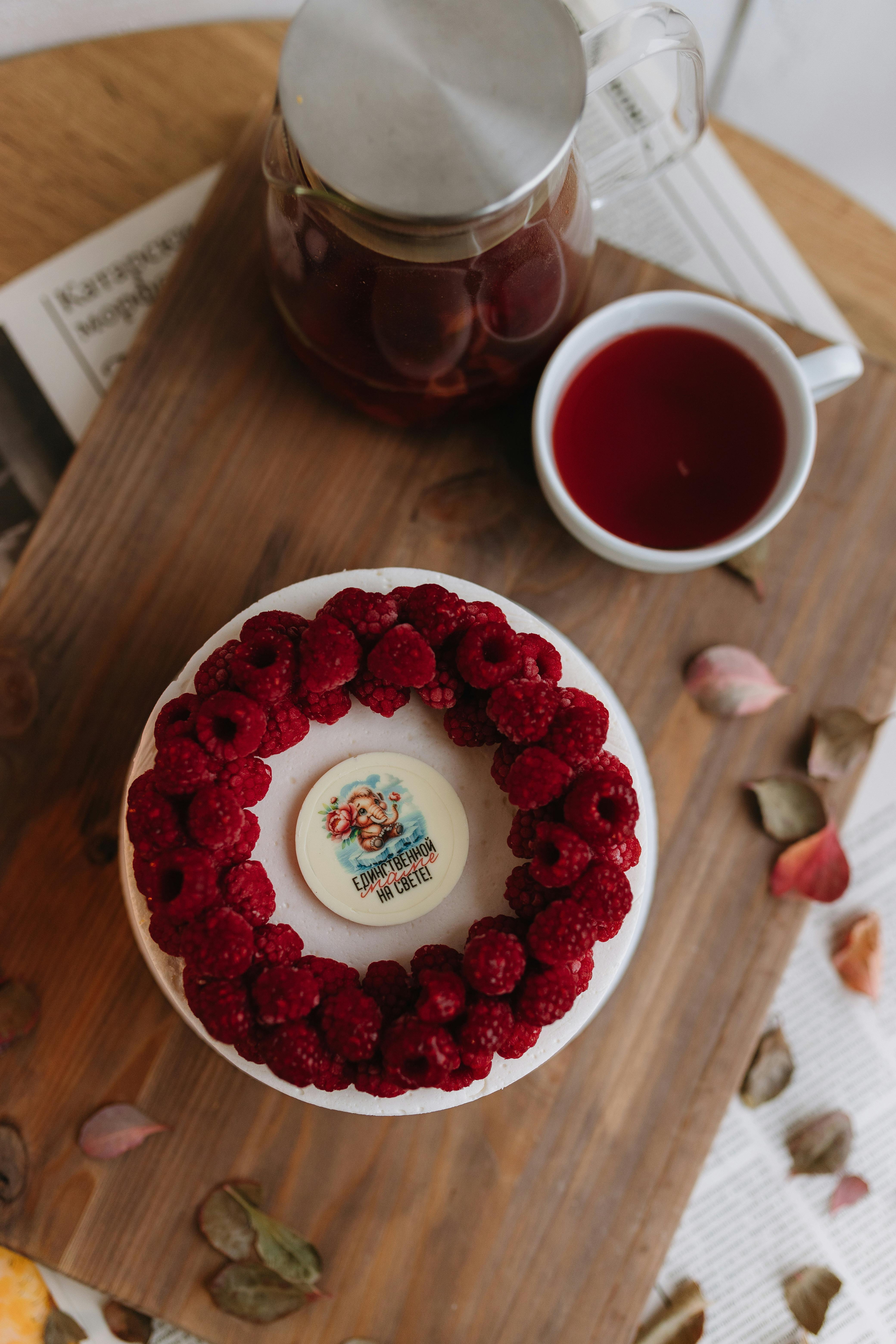 Raspberry Topped Cake with Tea on Wooden Board · Free Stock Photo