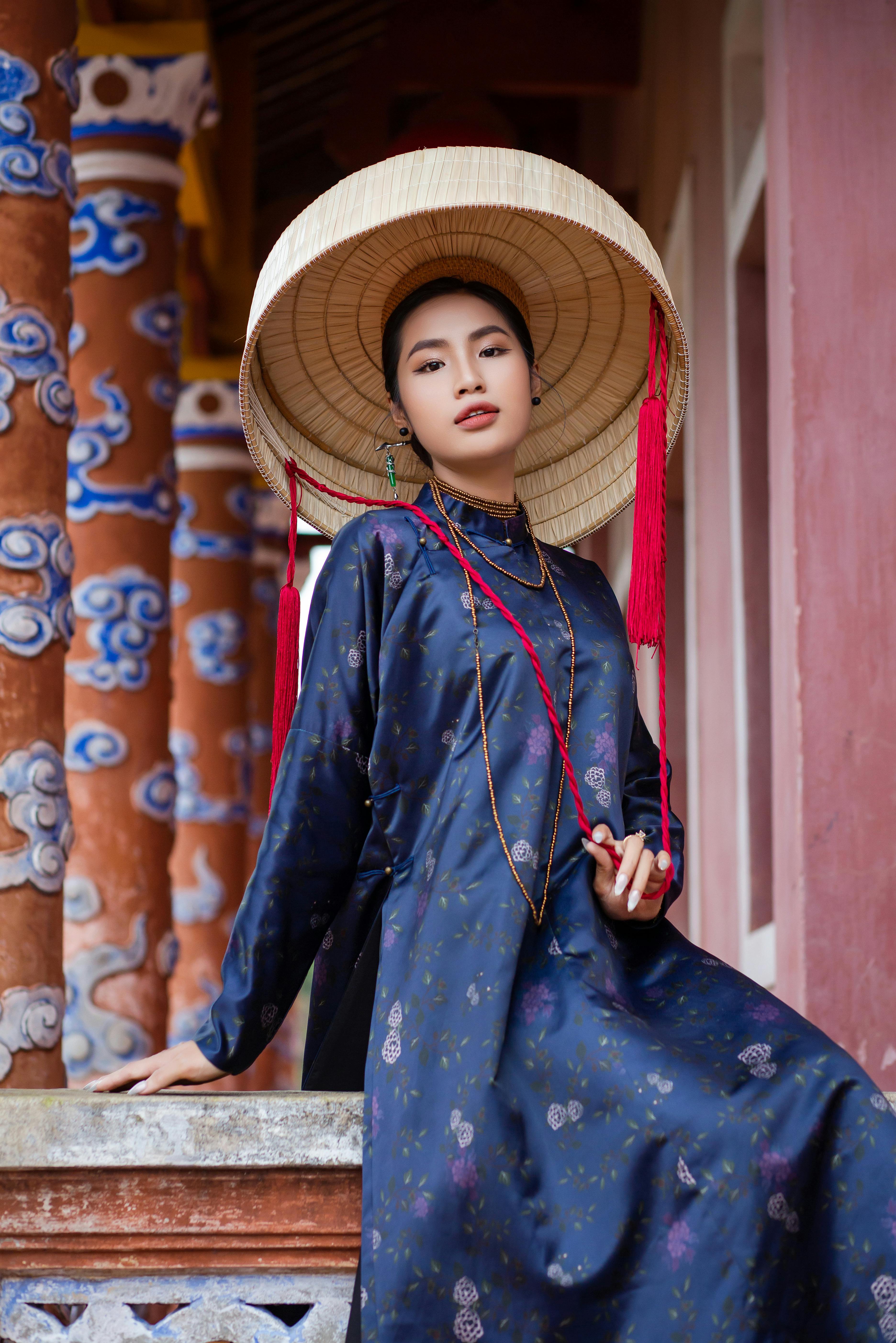 Traditional Vietnamese Attire in Hội An Setting · Free Stock Photo