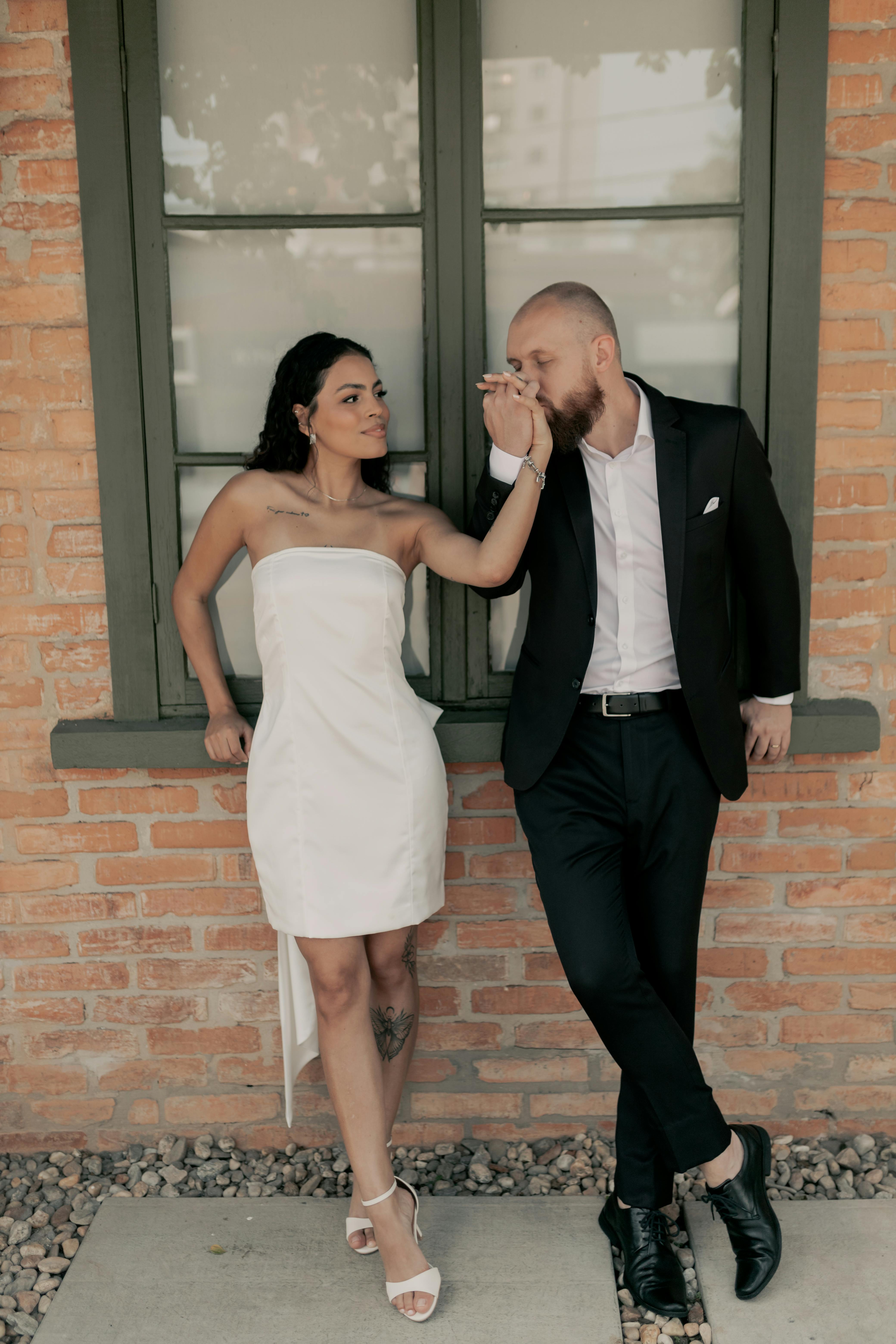 Elegant Couple Posing in Formal Wear Outdoors · Free Stock Photo