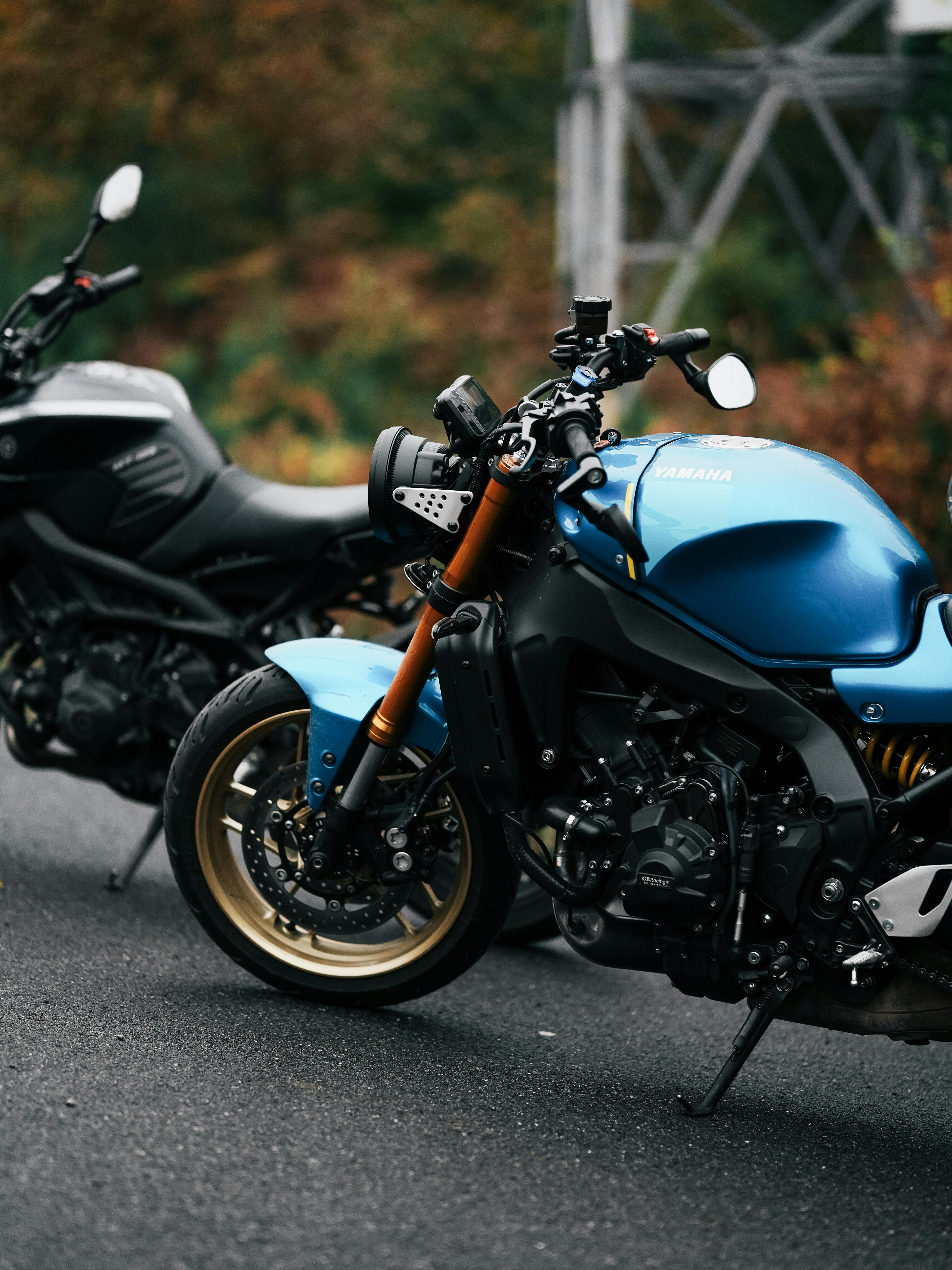 Two Modern Motorcycles Parked Outdoors · Free Stock Photo