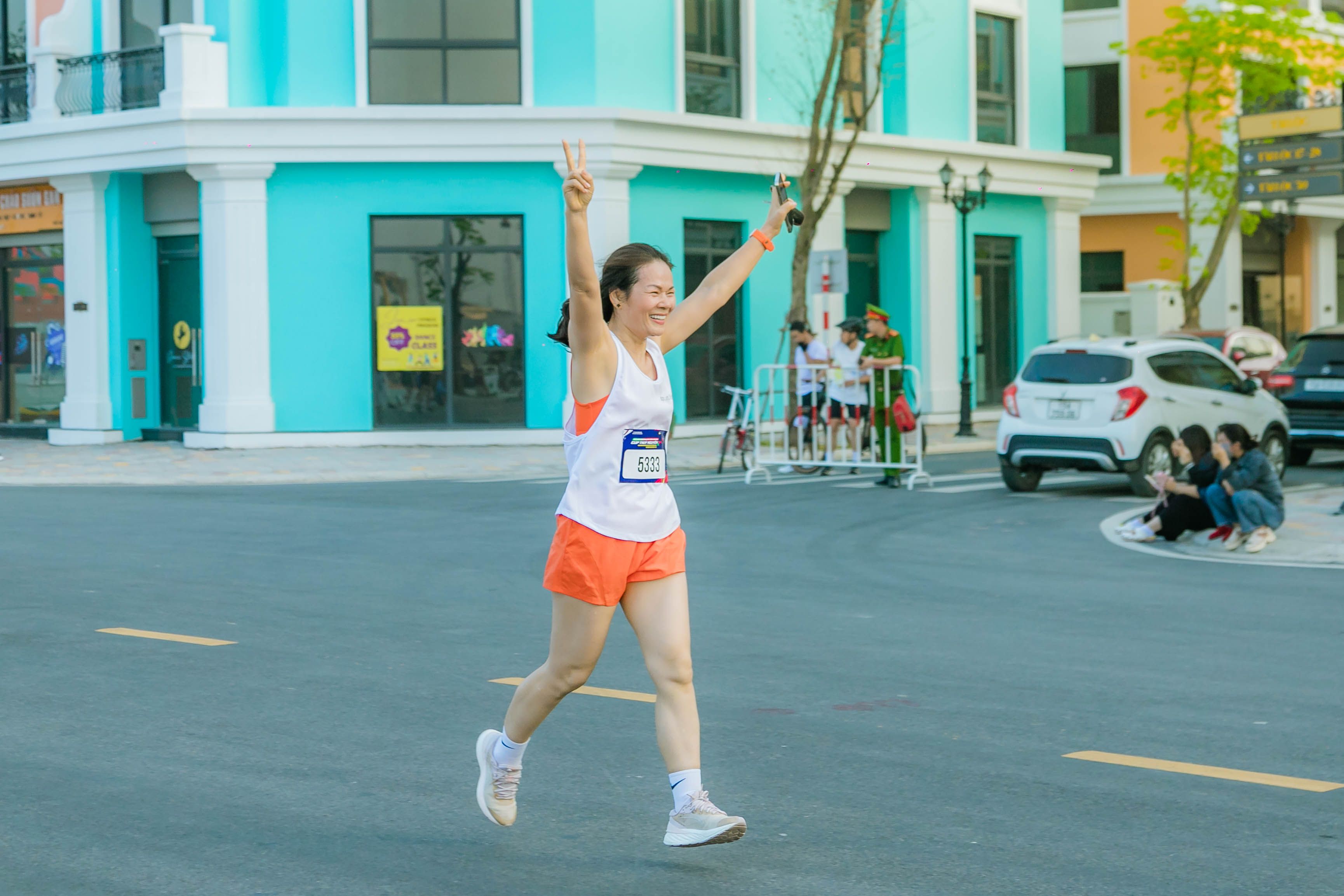 Vietnamese Marathon Runner Celebrates Victory · Free Stock Photo