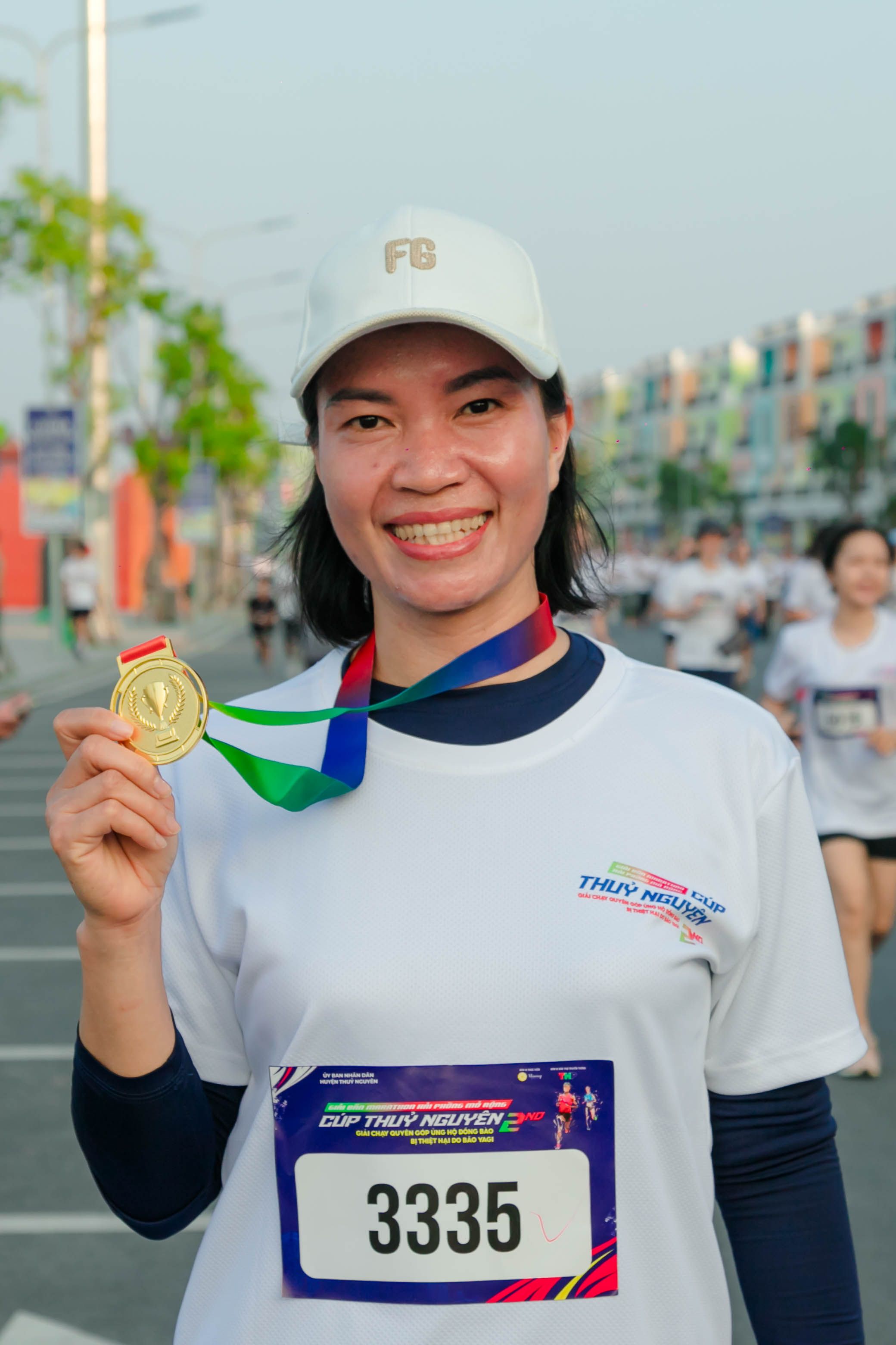 Smiling Marathon Winner with Medal in Hải Phòng · Free Stock Photo